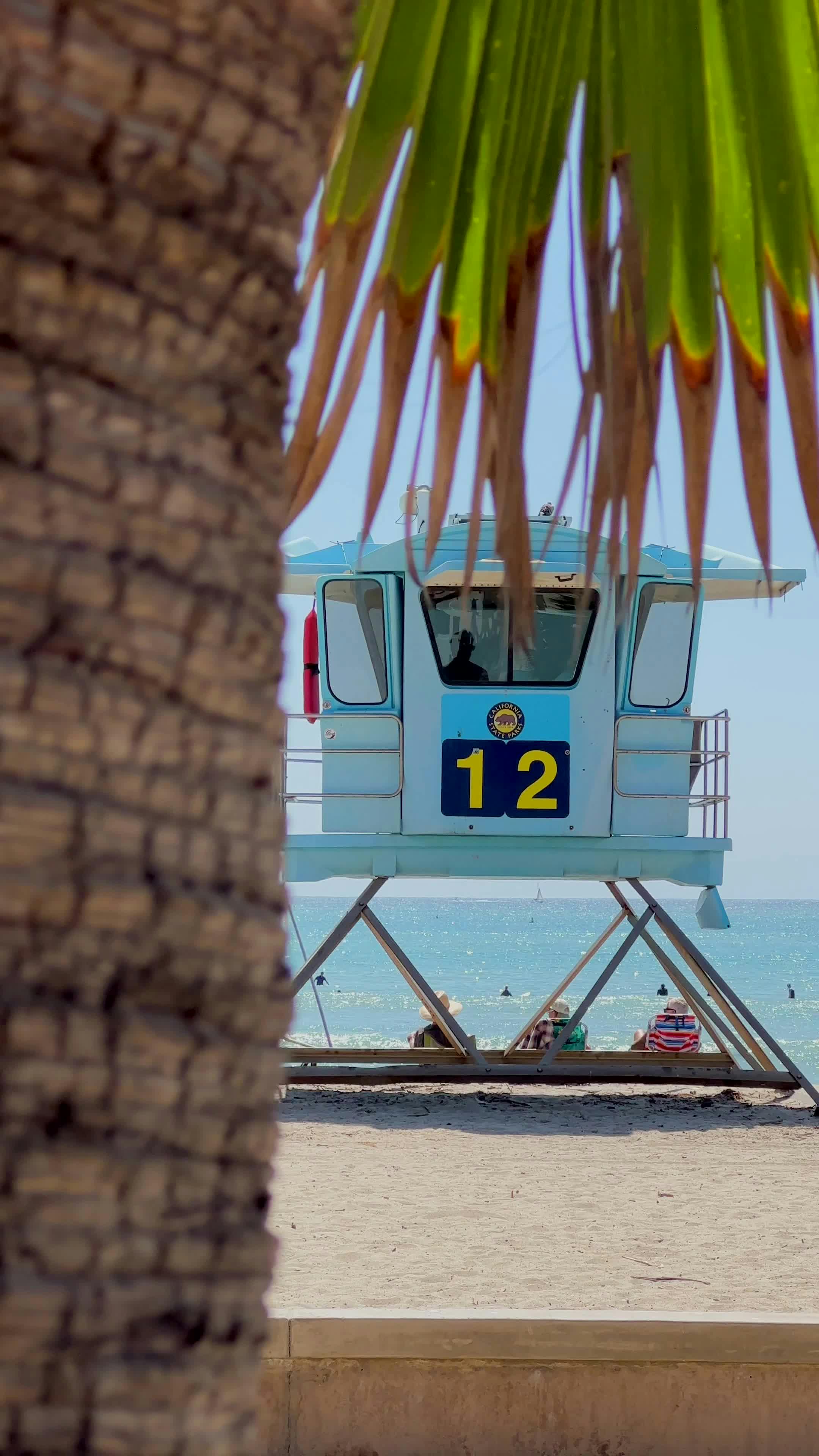 Sunny Beach Scene with Lifeguard Tower Free Stock Video Footage ...
