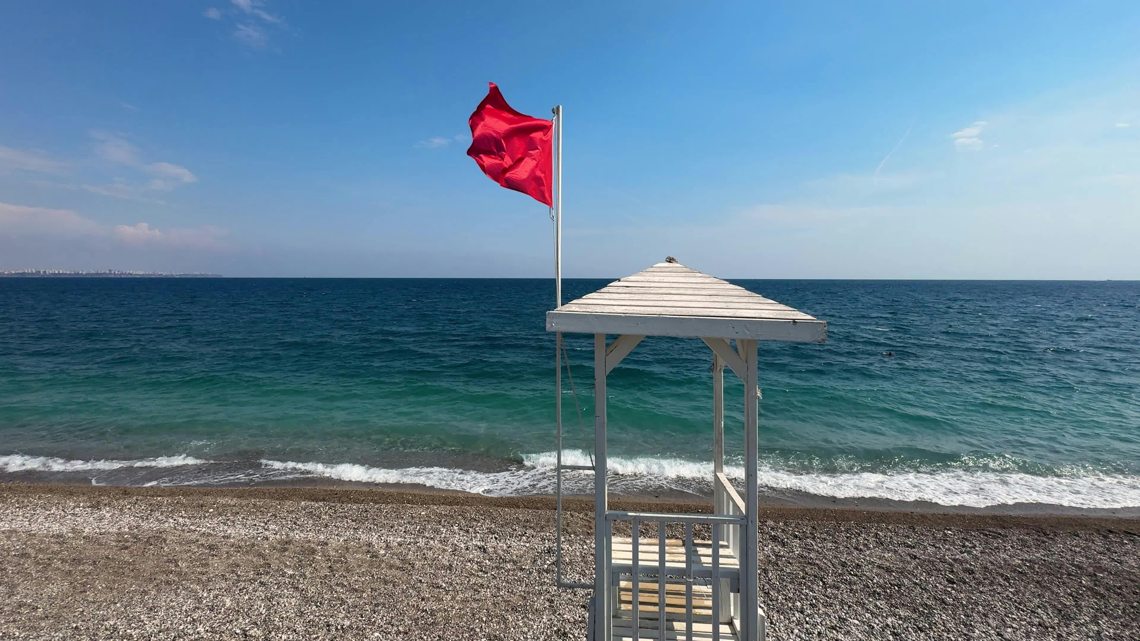 Seaside Lifeguard Tower with Red Safety Flag Free Stock Video Footage ...