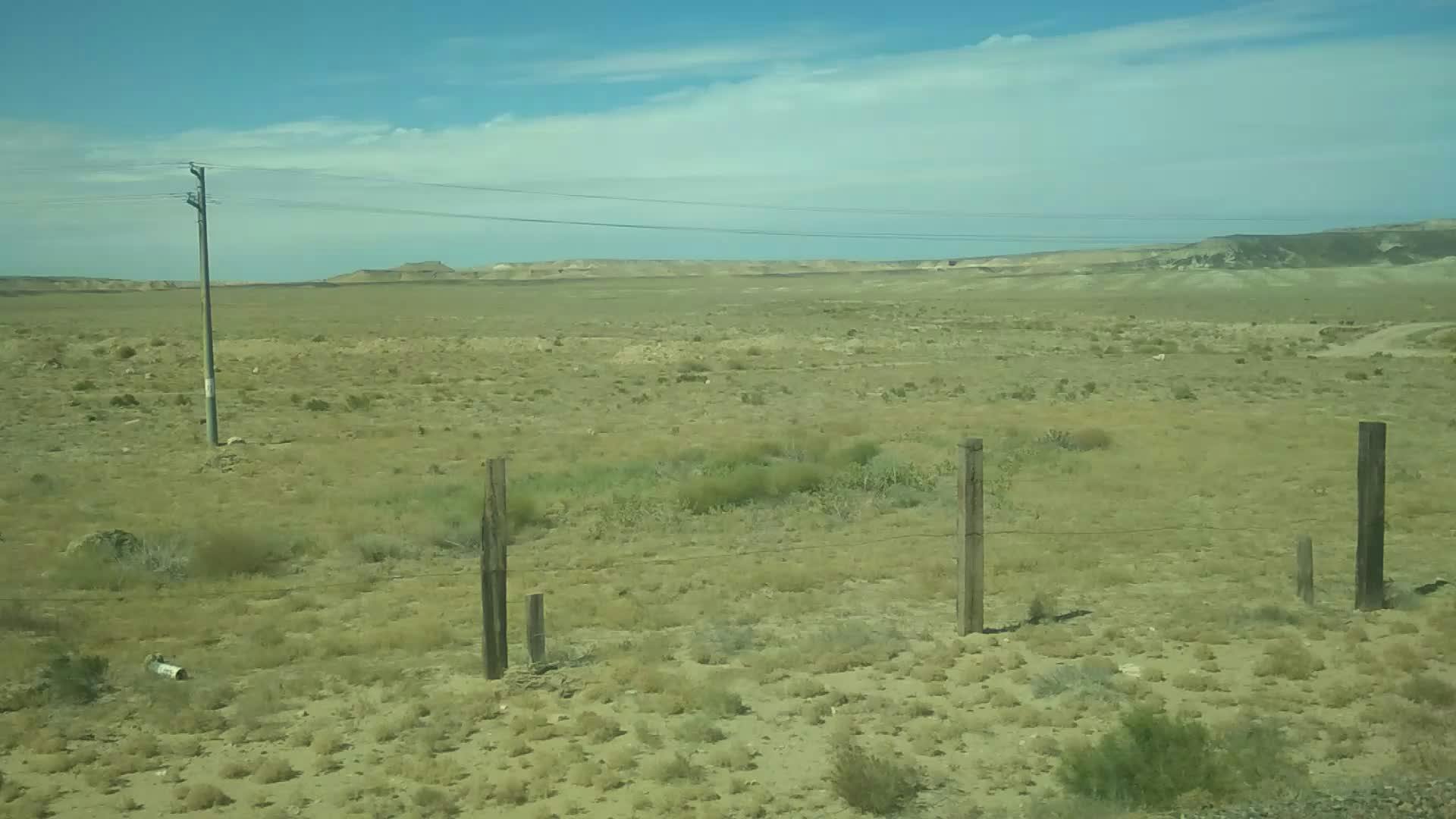 Sprawling Desert Landscape Under Clear Blue Sky Free Stock Video ...