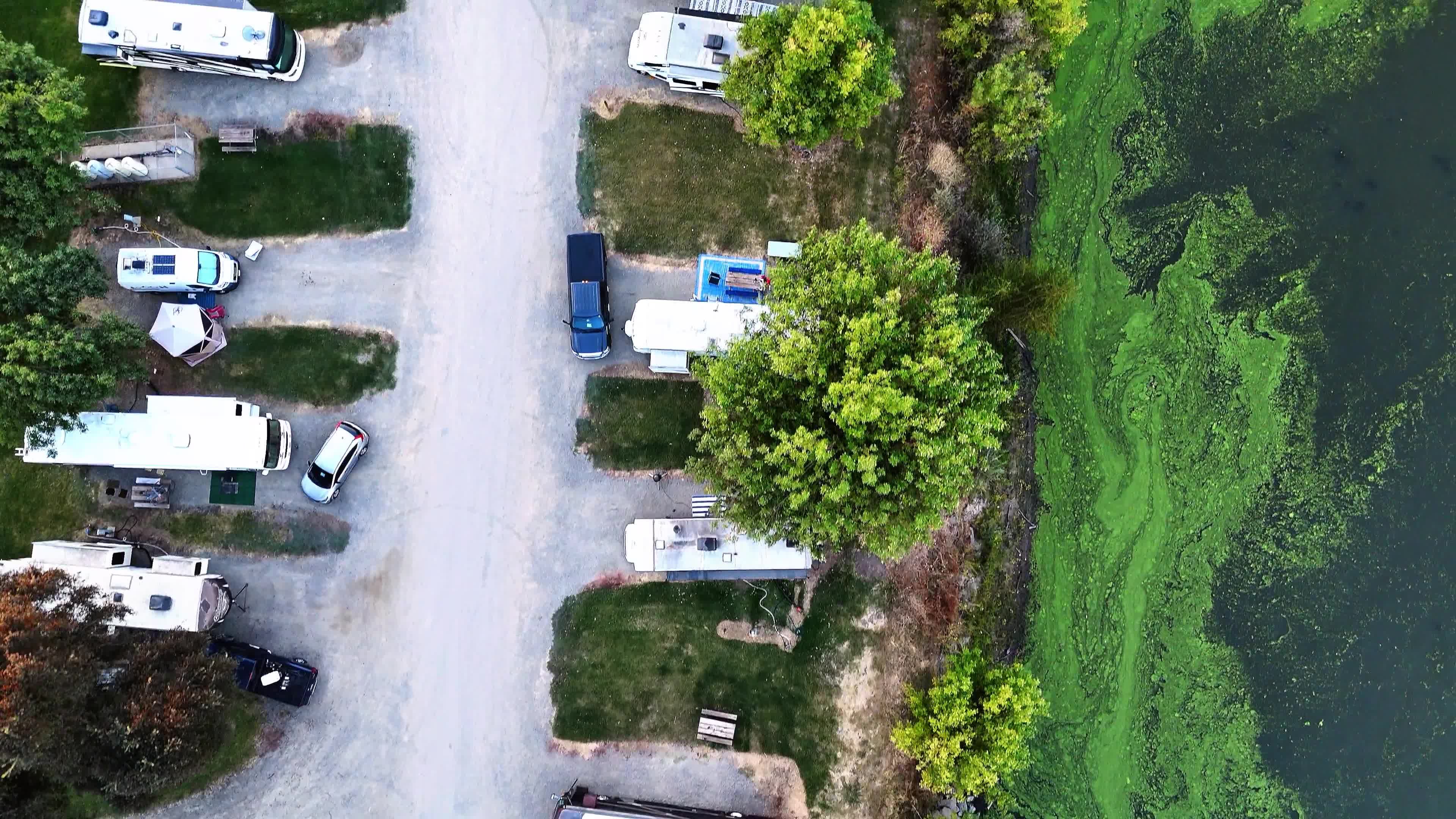 Aerial View of RV Park Next to Algae-Covered Pond Free Stock Video ...