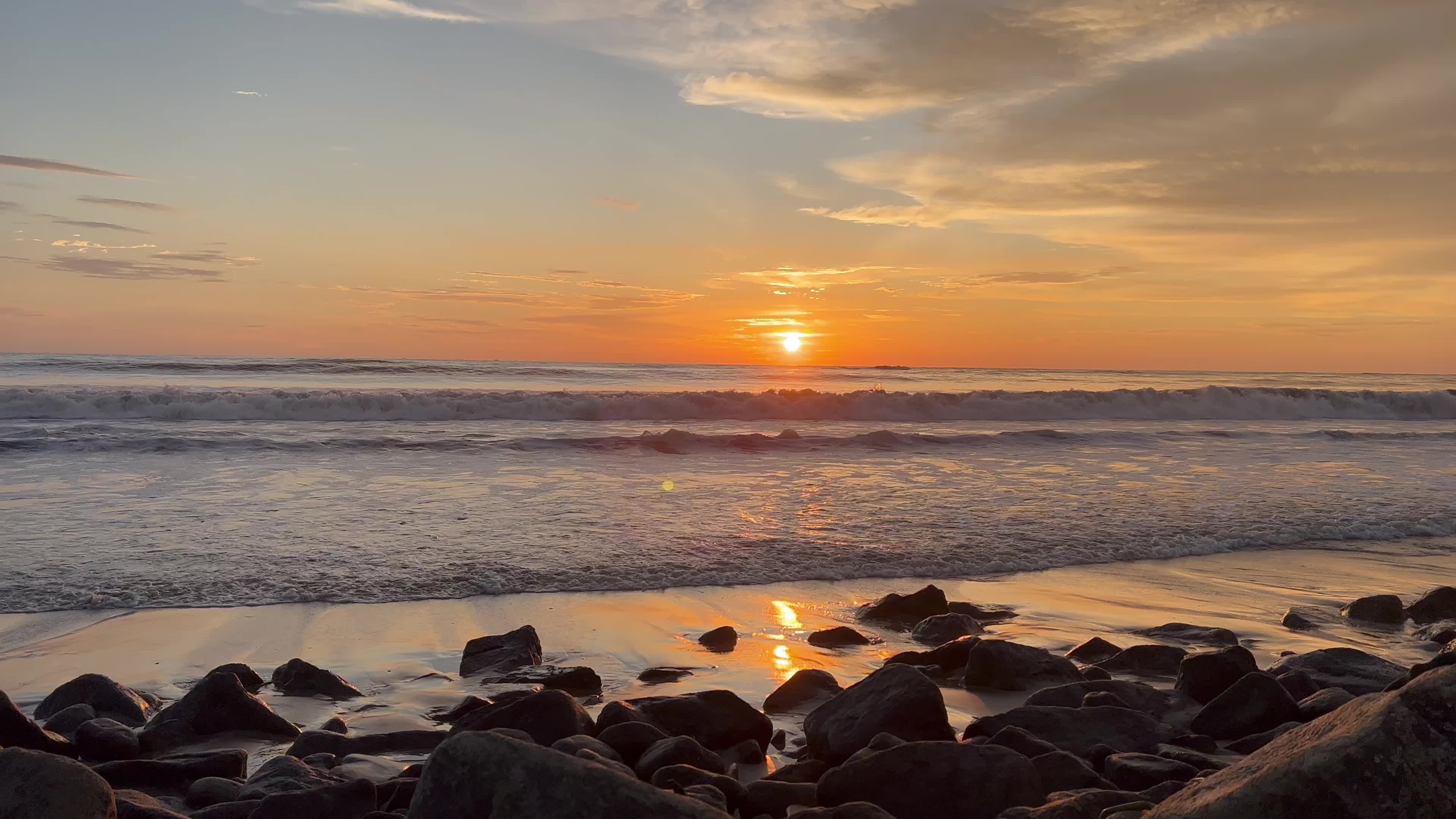 Serene Beach Sunset Over Rocky Shoreline Free Stock Video Footage ...