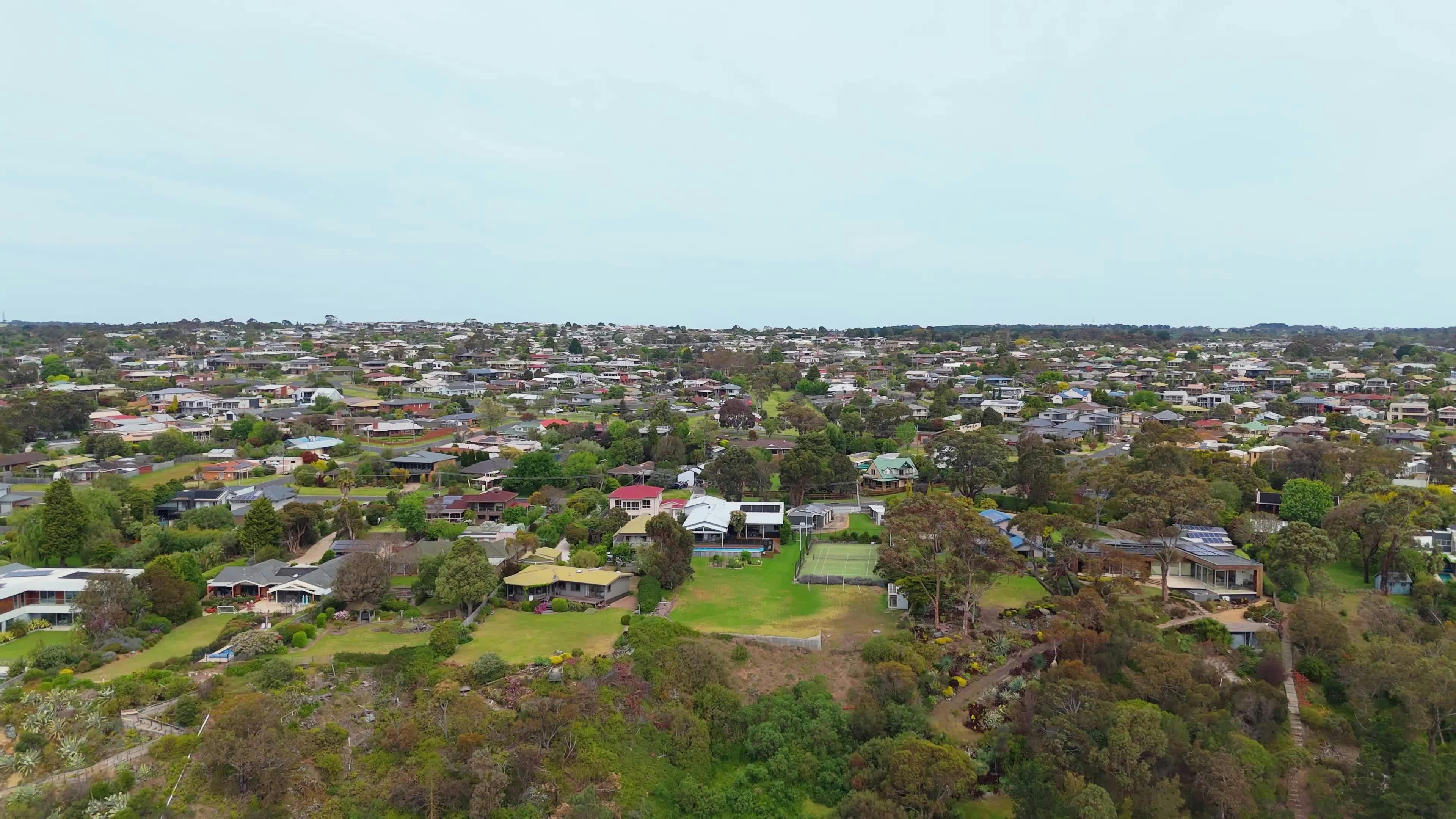 Aerial View of Coastal Suburb with Lush Greenery Free Stock Video ...