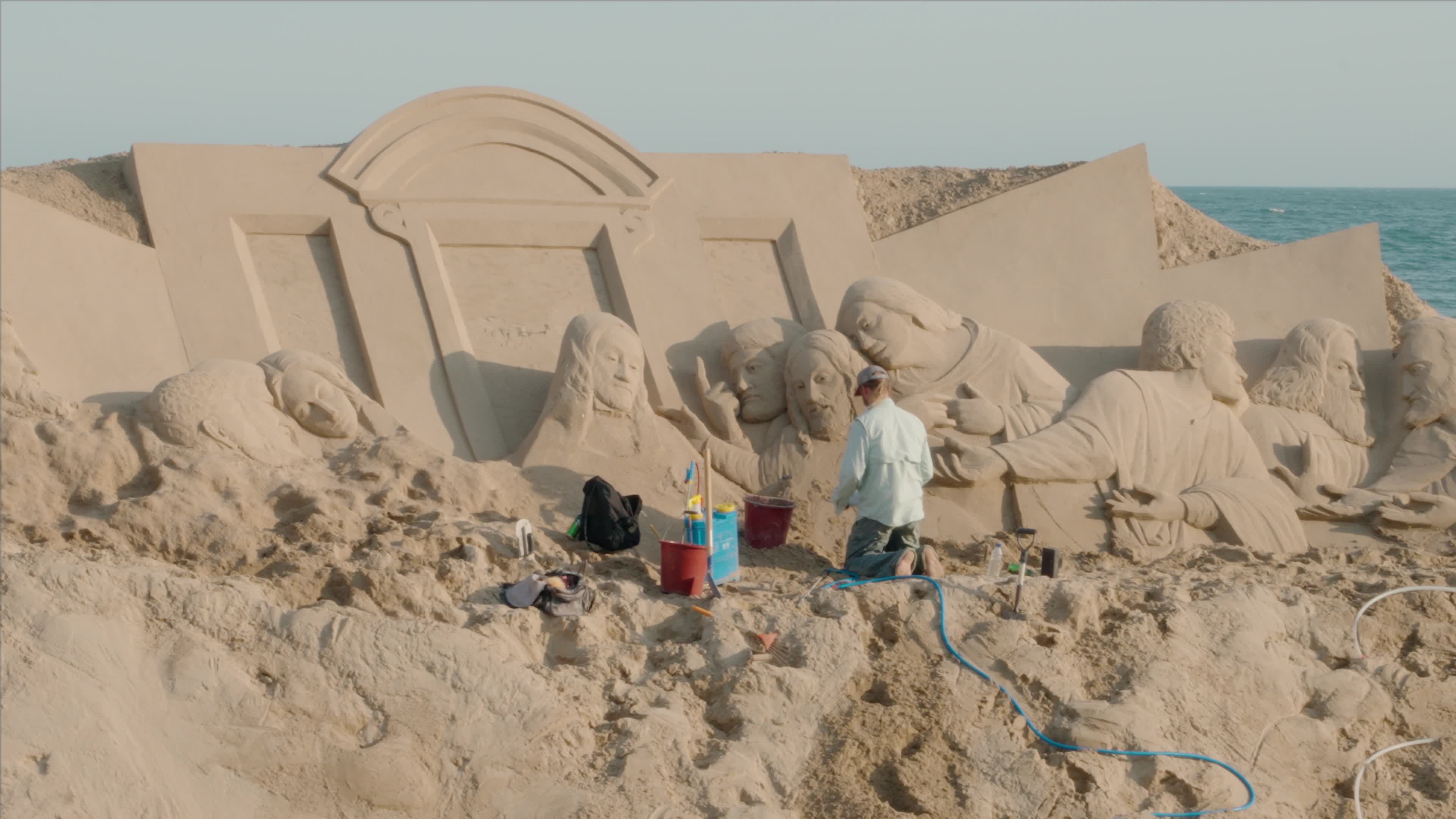 Artisan Creating Intricate Sand Sculpture by the Sea Free Stock Video ...