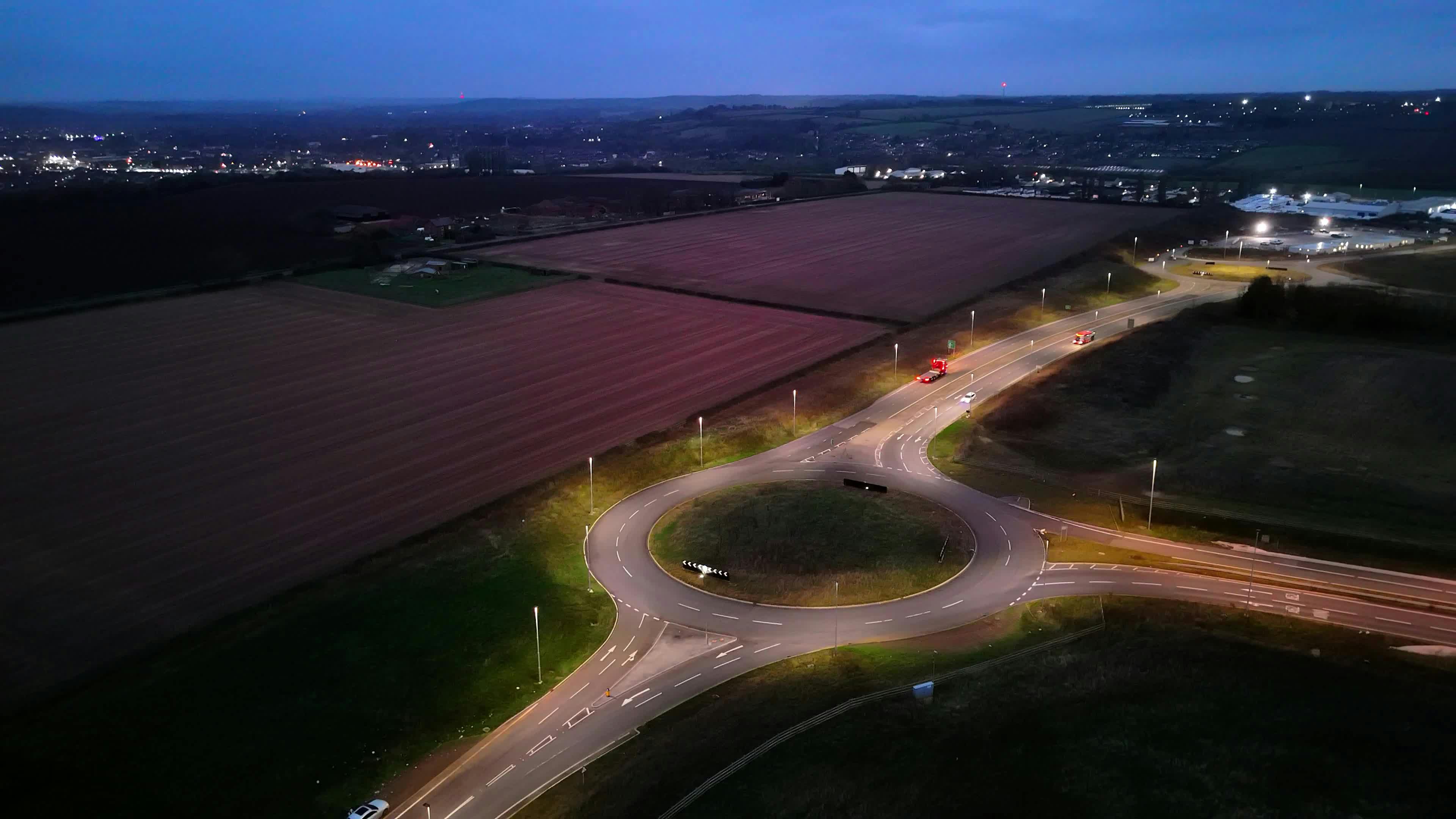 Aerial View of Illuminated Rural Roundabout at Night Free Stock Video ...