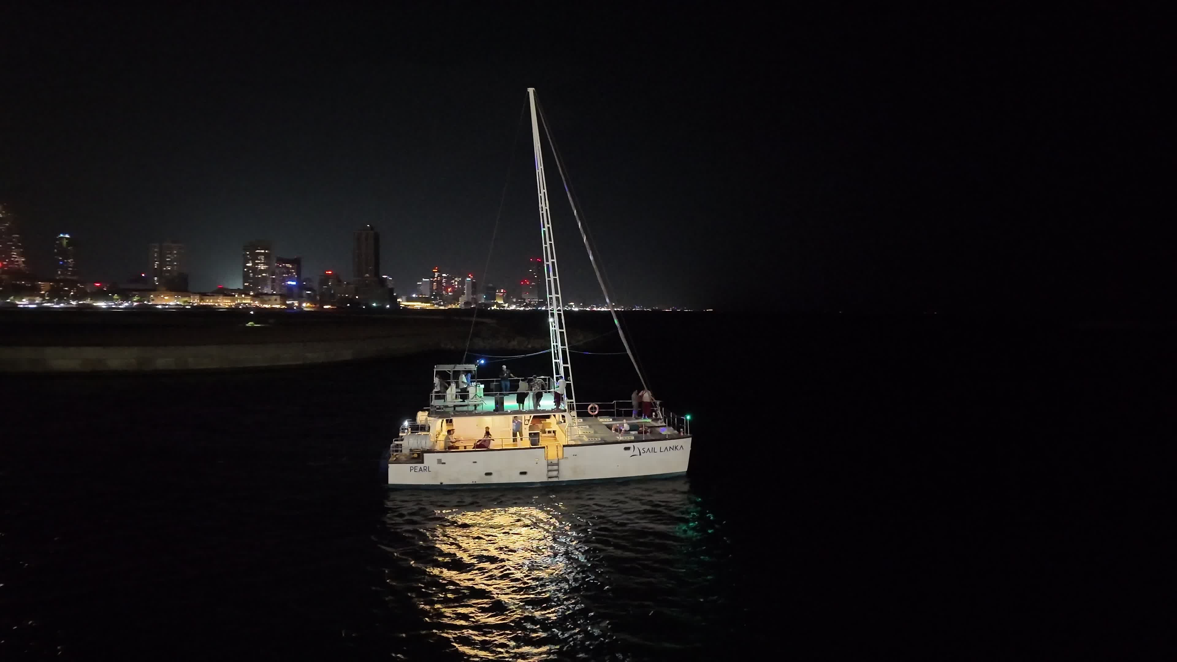 Nighttime Sailboat on a Serene Urban Waterfront Free Stock Video ...