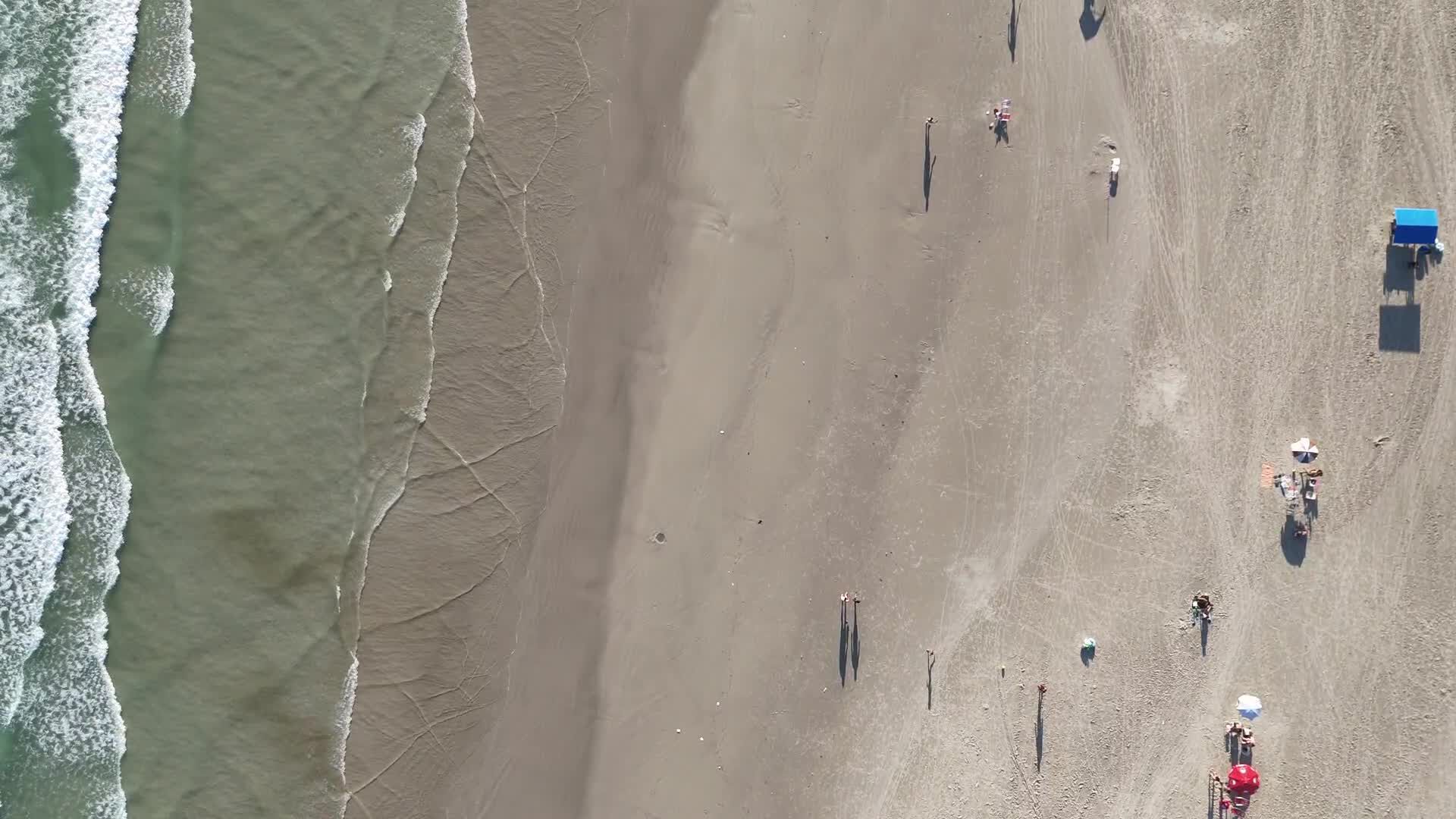 Aerial Beach Scene with Waves and Umbrellas Free Stock Video Footage ...