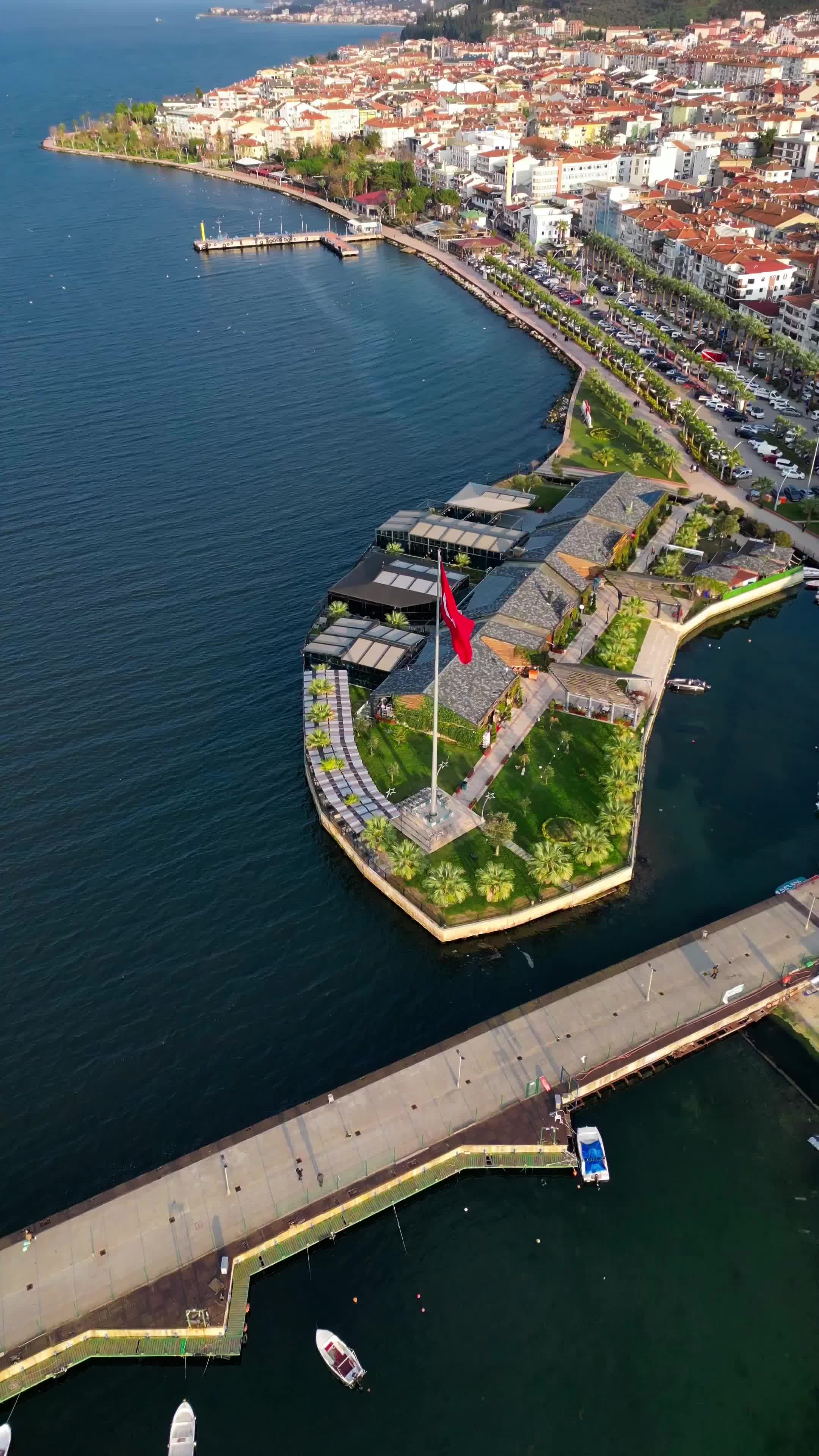 Aerial View of Harbor with Flag and Cityscape Free Stock Video Footage ...