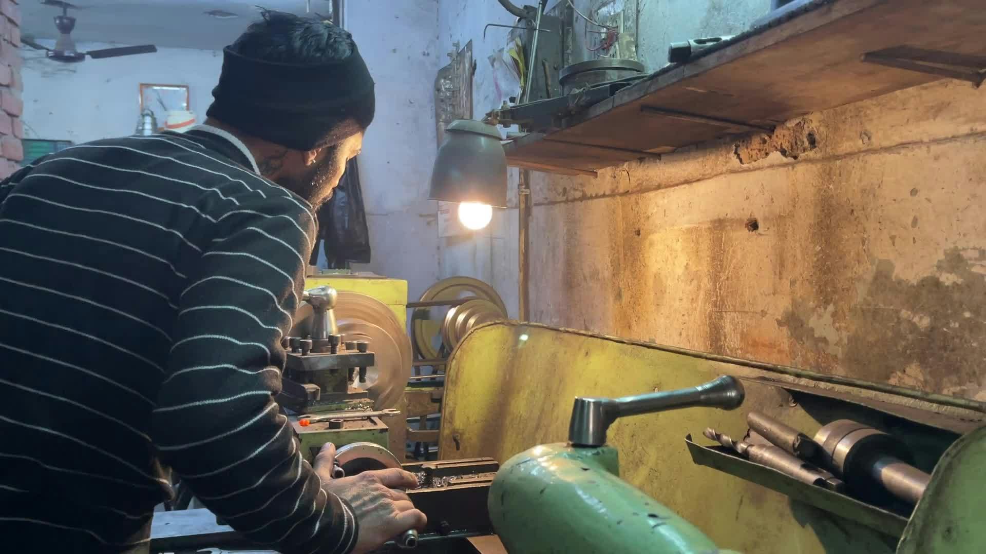 Skilled Worker Operating a Manual Lathe in Workshop Free Stock Video ...