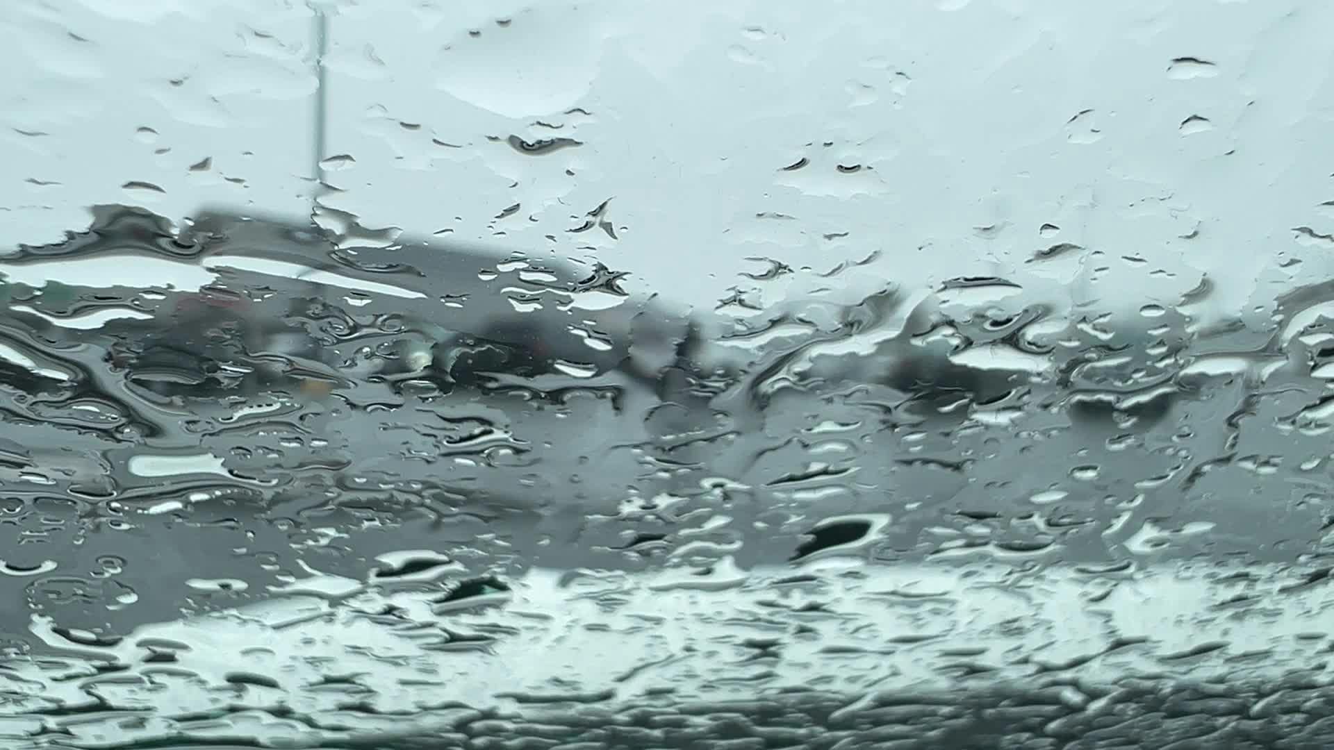 Rainy Window View with Raindrops Blurring Skyline Free Stock Video ...