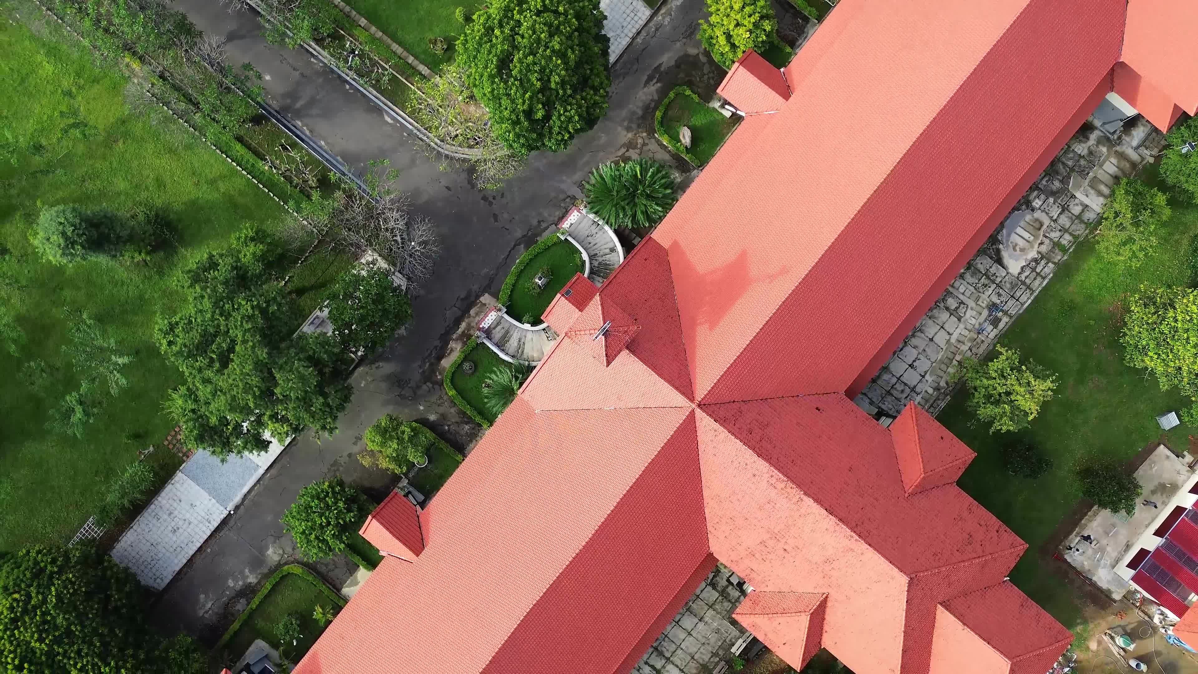 Aerial View of Red Roof Building and Green Landscape Free Stock Video ...