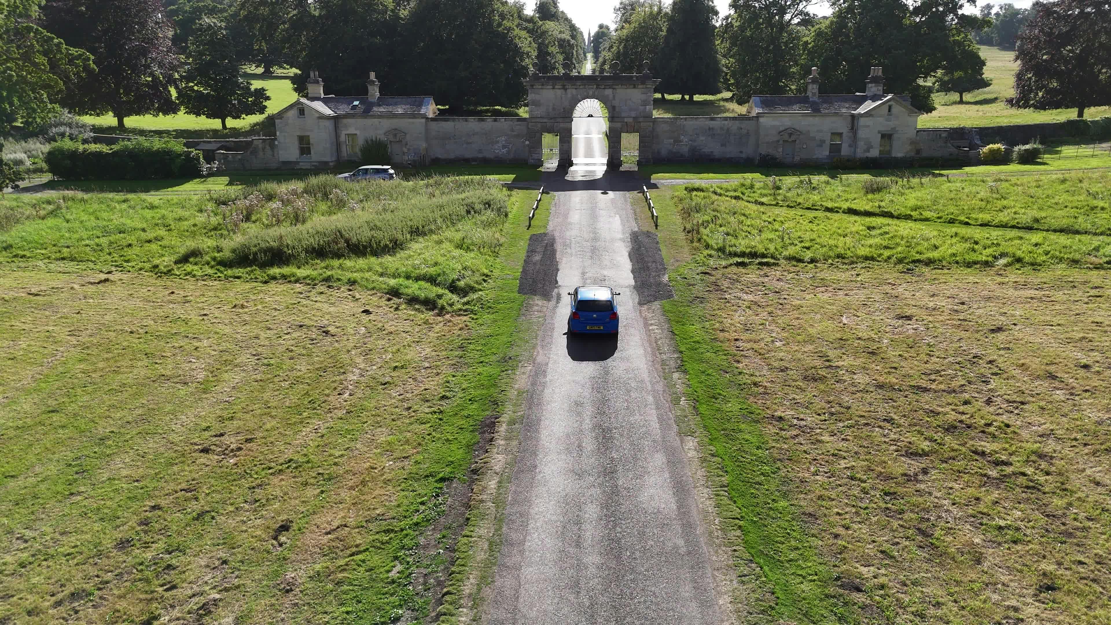 Aerial View of Car Approaching Historic Gate Free Stock Video Footage ...