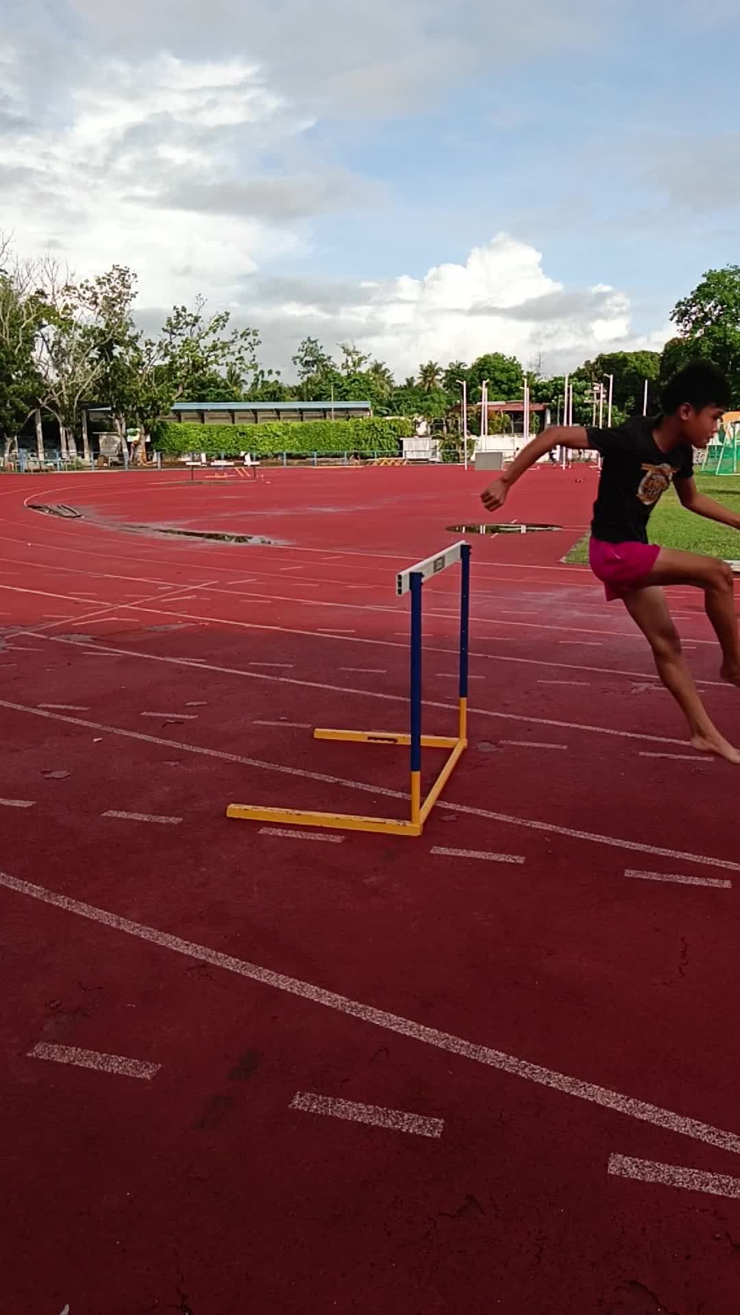 Athlete Training on Outdoor Track with Hurdles Free Stock Video Footage ...