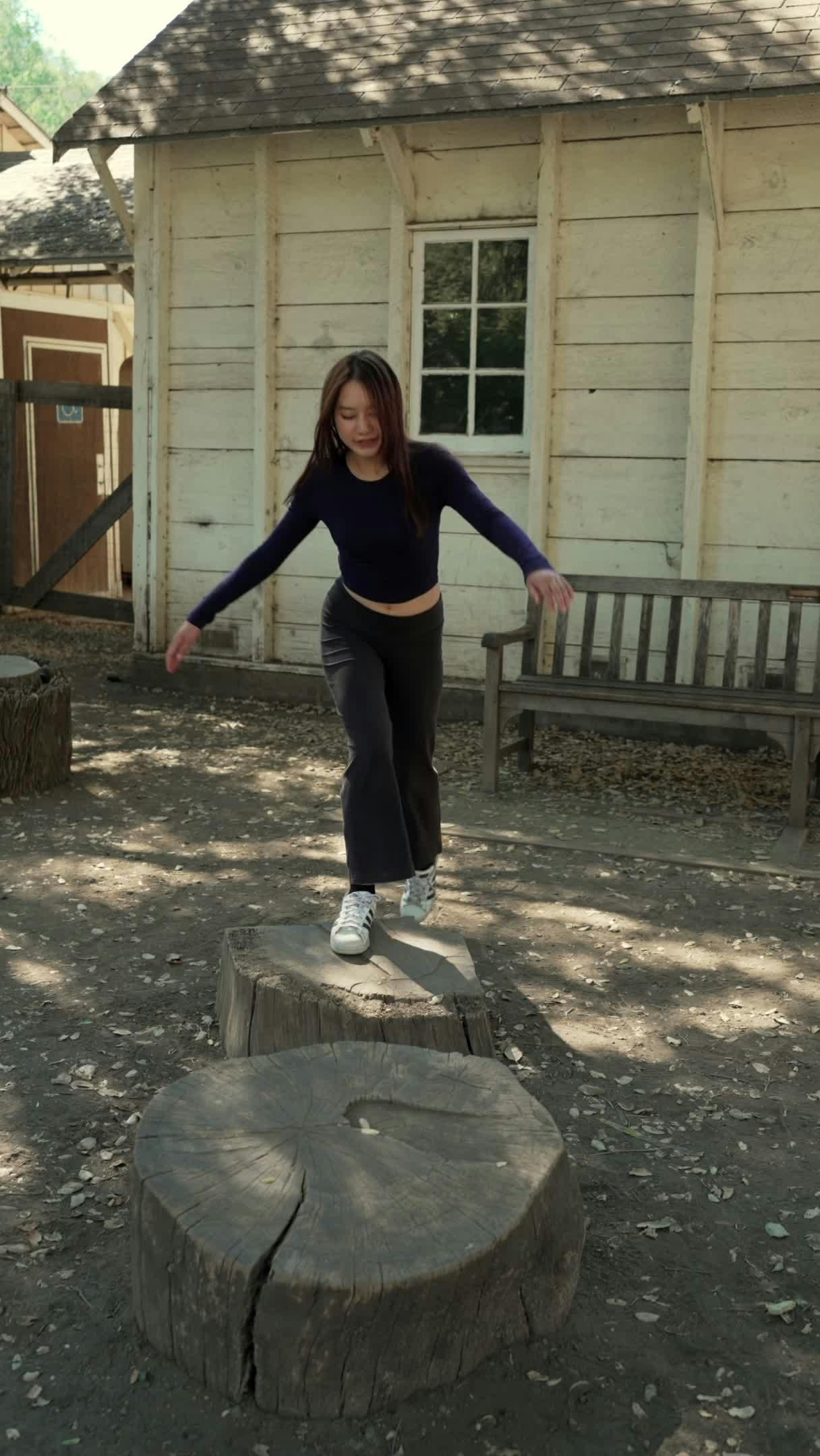 Young Woman Balancing on Tree Stump Outdoors Free Stock Video Footage ...