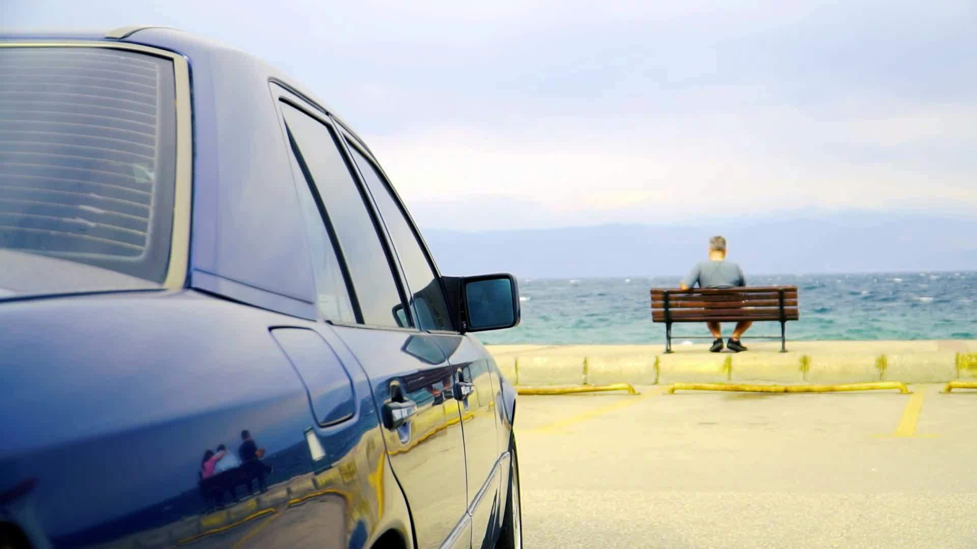 Lonely Man by the Sea with a Blue Car Free Stock Video Footage, Royalty ...