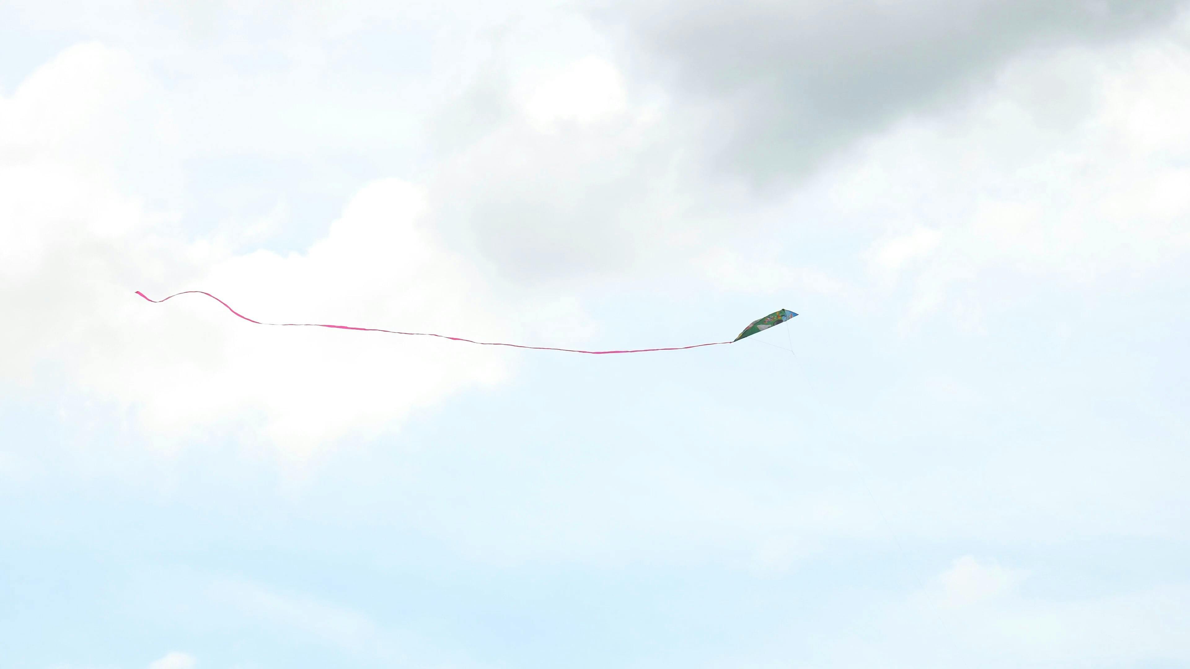 Low angle Footage Of An Airborne Kite Dancing With The Wind · Free ...