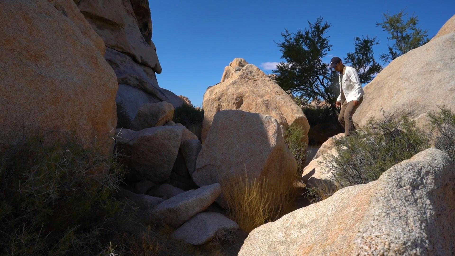 Man Stepping On Rocks And Boulders To Cross · Free Stock Video