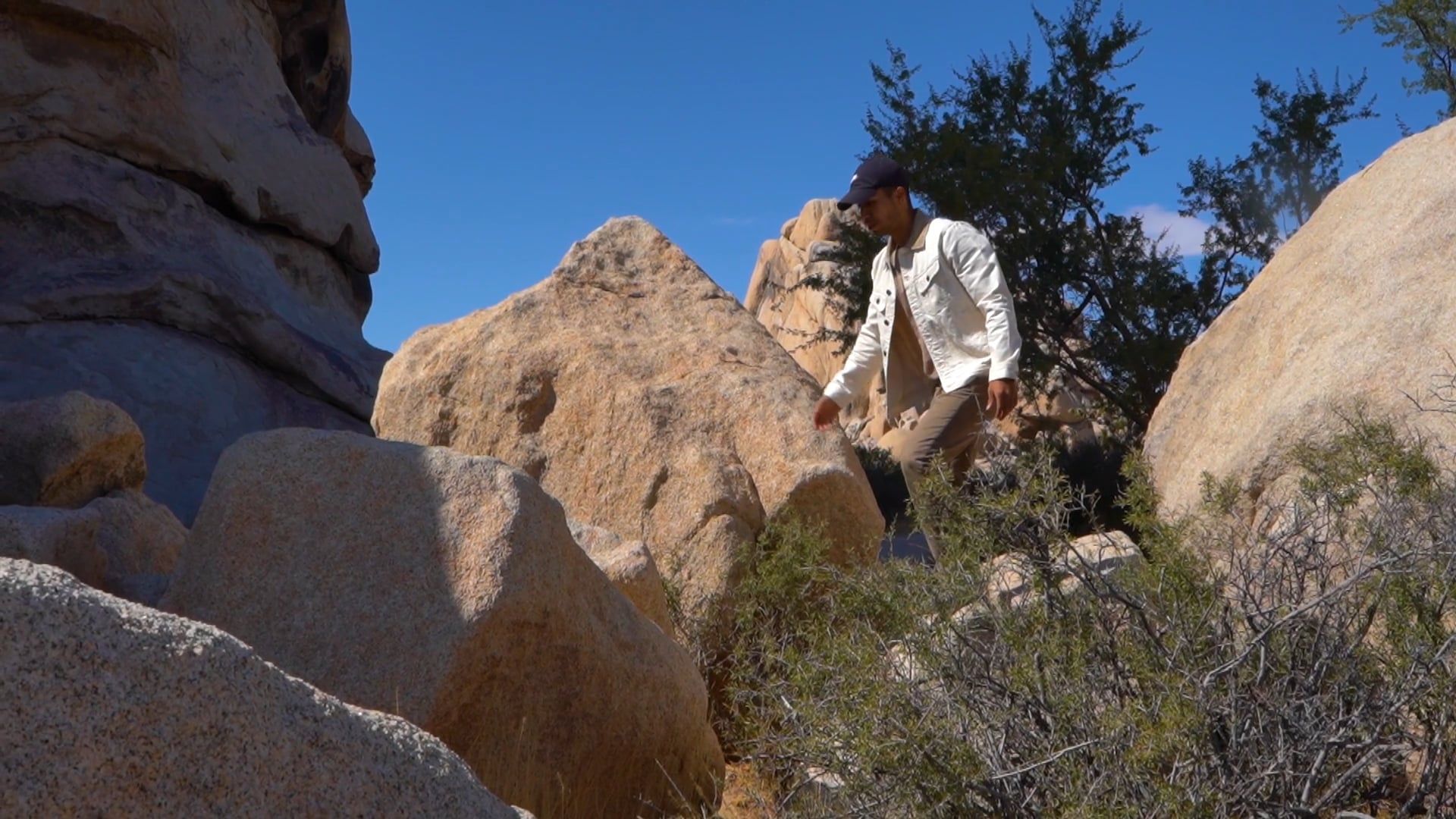Man Stepping On Rocks To Cross · Free Stock Video