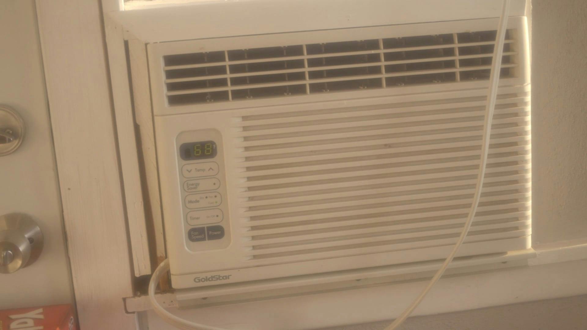 An Air Conditioner Installed On A Window · Free Stock Video