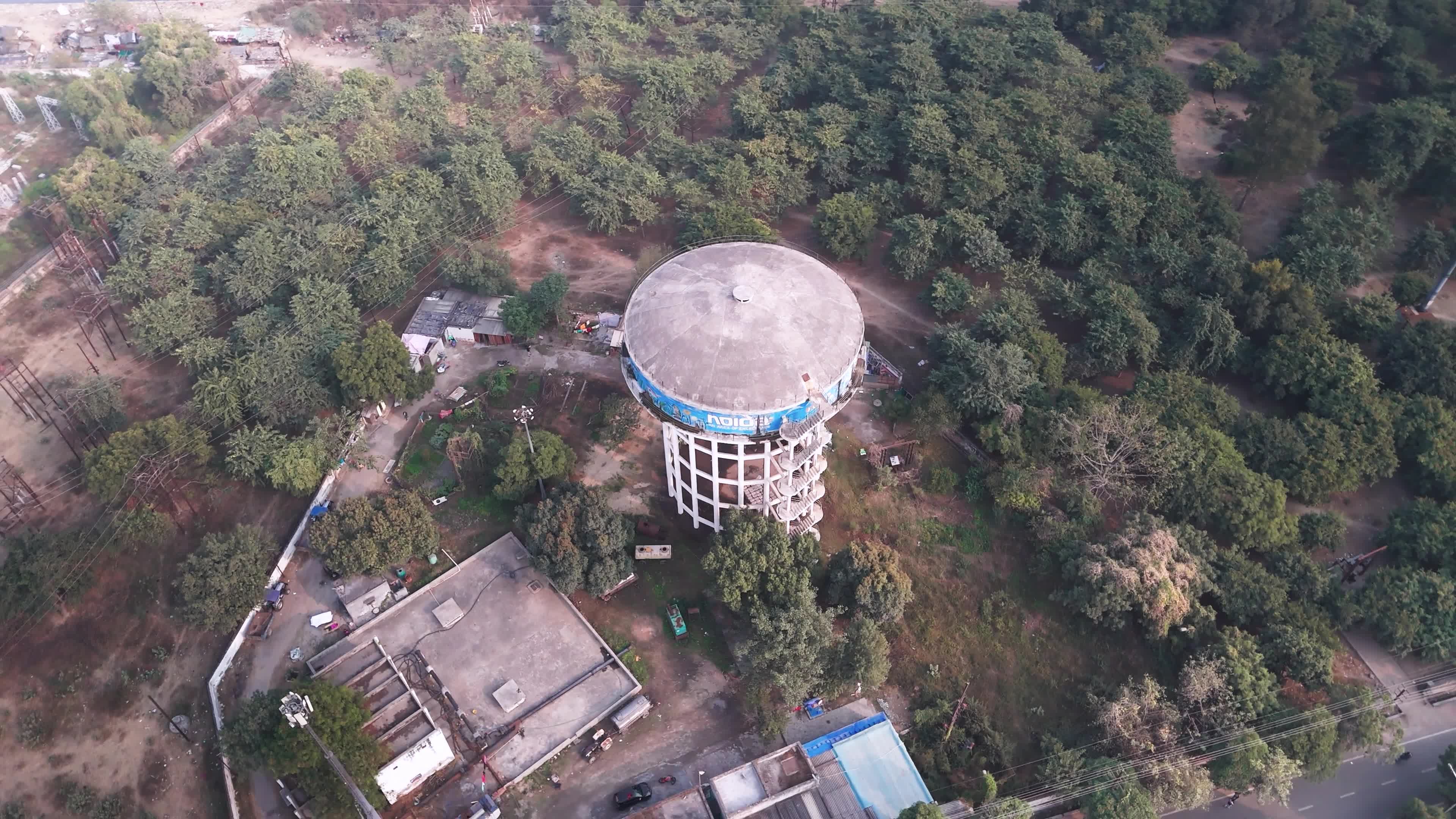 Aerial View of Urban Water Tower Amidst Trees Free Stock Video Footage ...