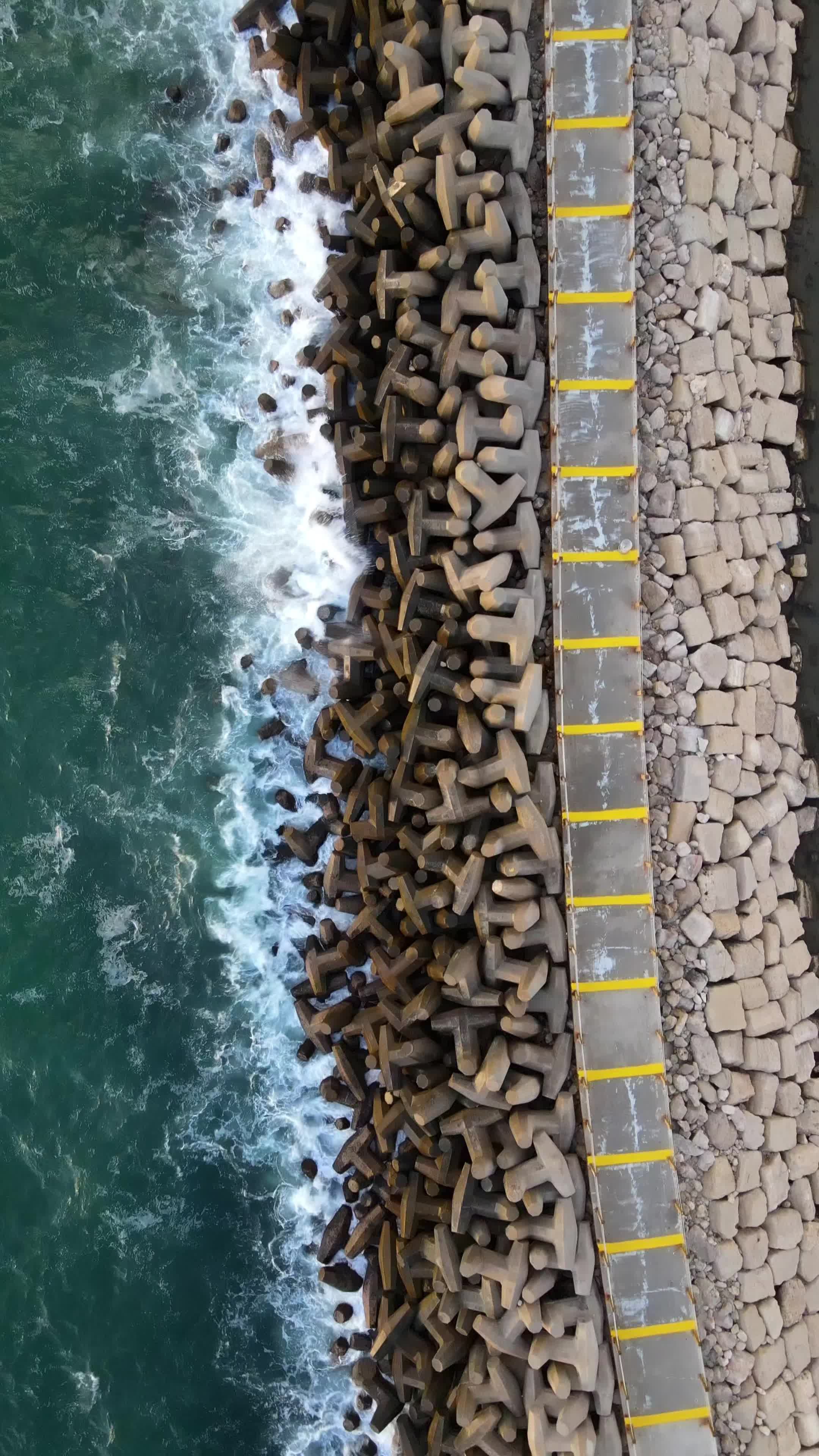Aerial View of Rocky Coastal Breakwater Free Stock Video Footage ...