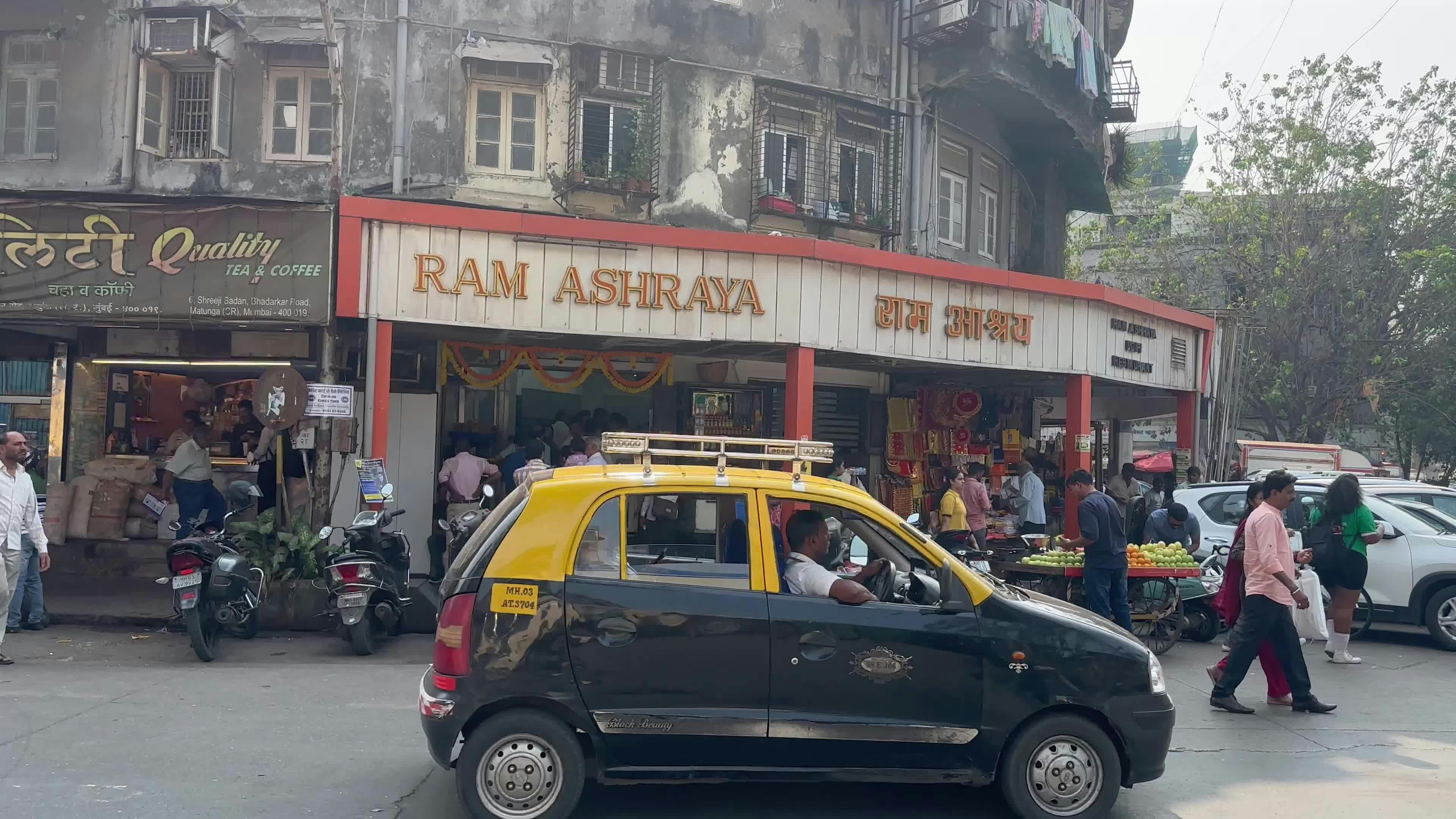 Bustling Street Scene Outside Ram Ashraya Restaurant Free Stock Video ...