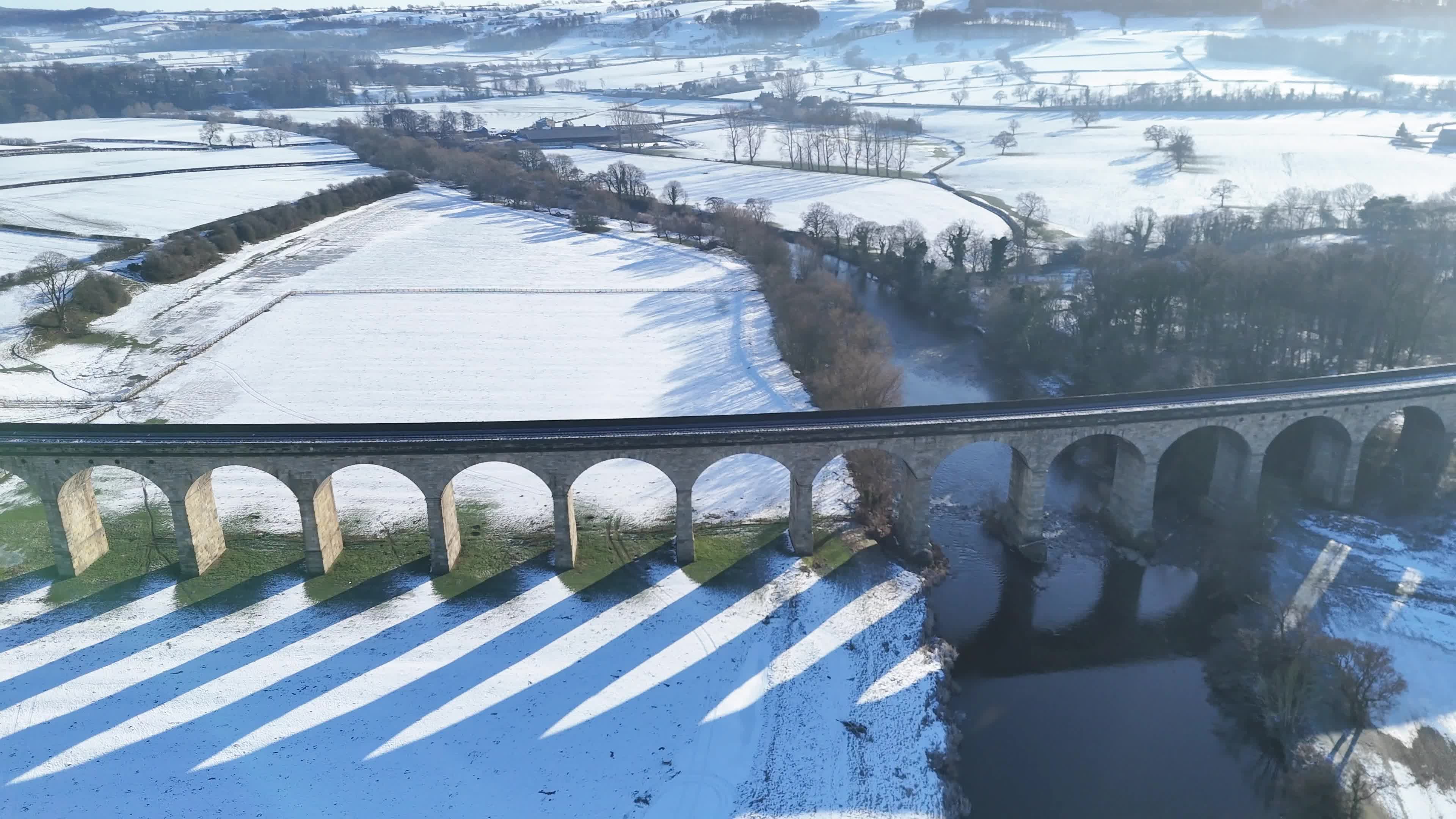 Aerial View of Snowy Viaduct in Winter Landscape Free Stock Video ...