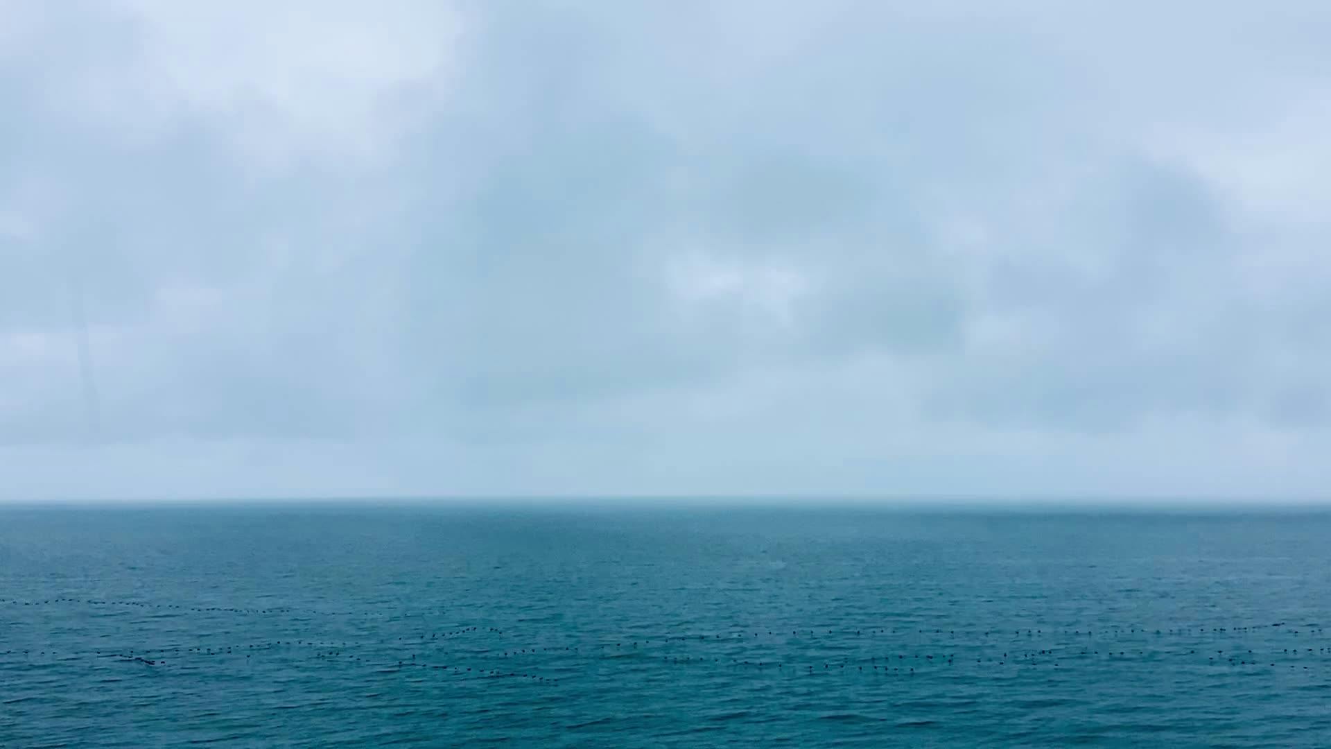 Serene Overcast Ocean View with Rain Free Stock Video Footage, Royalty ...