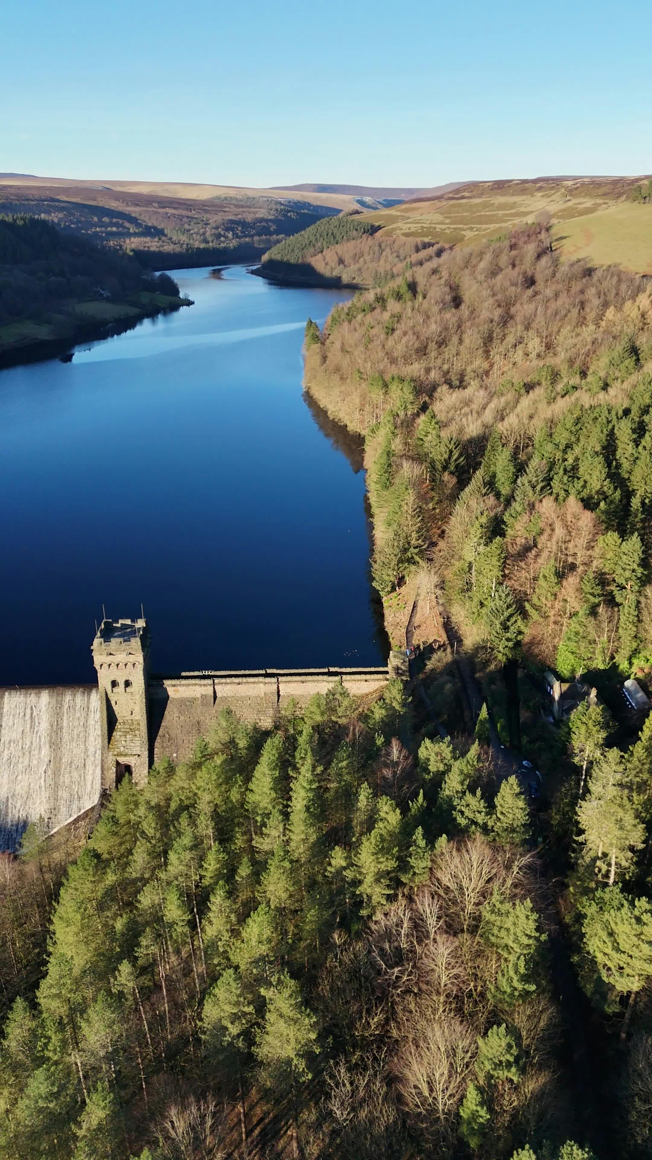 Aerial Overhead of Towering Dam and Serene Lake Free Stock Video ...