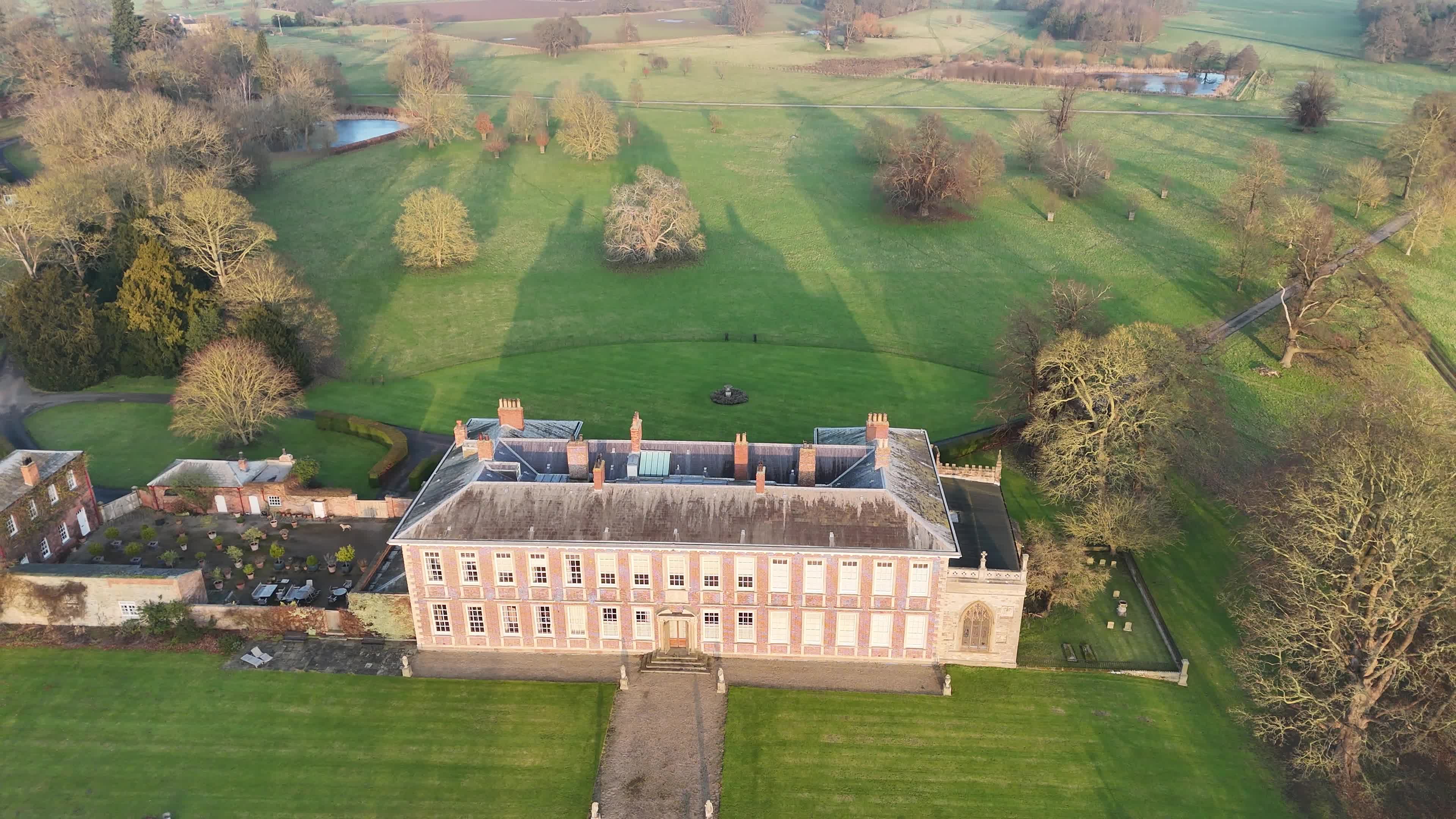 Aerial View of Historic Manor Surrounded by Lush Greenery Free Stock ...