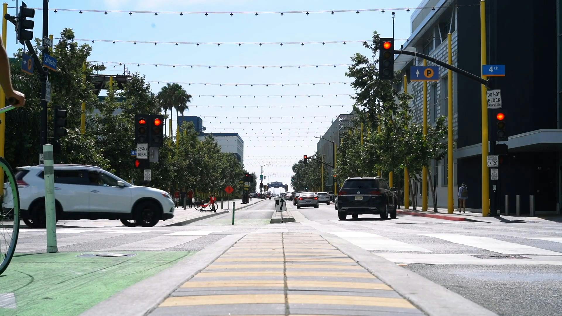 Low Angle Footage Of Pedestrian Traffic Of A City Street Corner With A ...