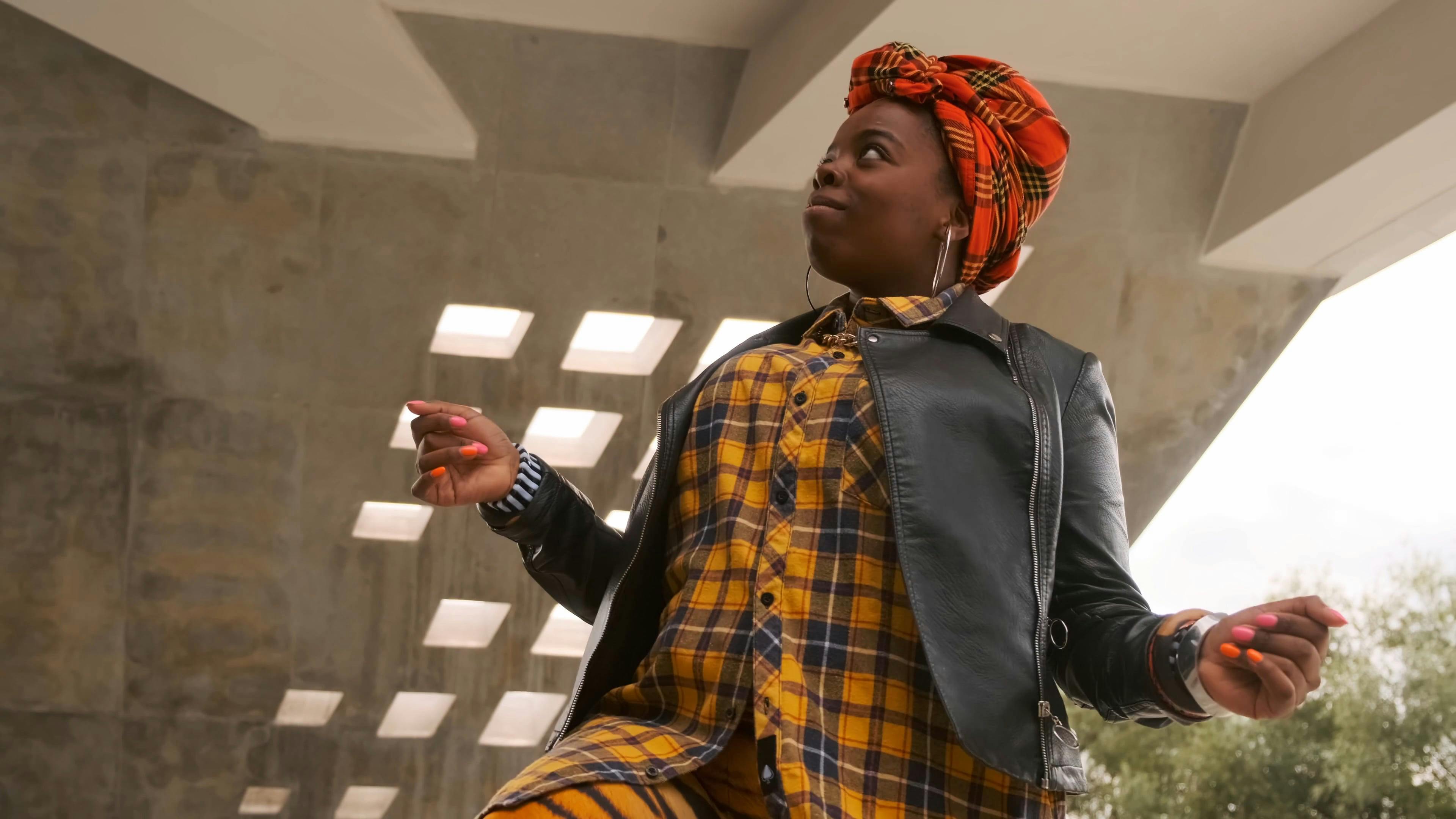 A Woman Dancing Freely Outdoors On A Concrete Pavement Free Stock Video ...