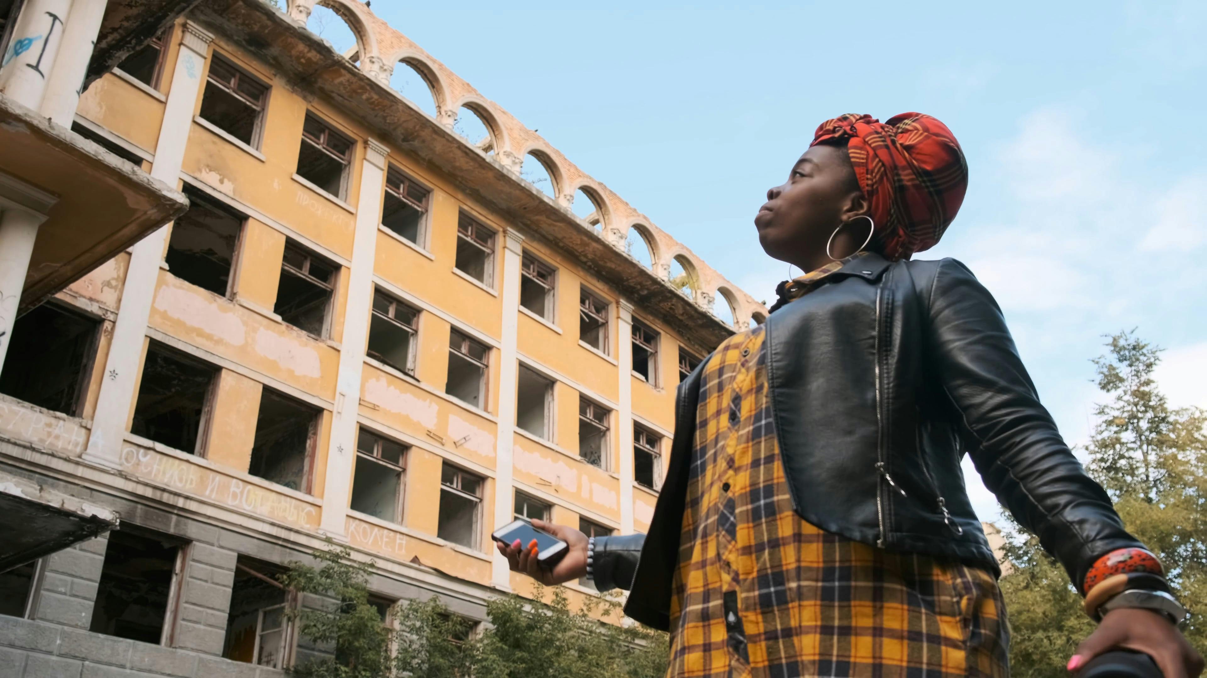 A Woman Dancing Freely Outdoors On A Concrete Pavement Free Stock Video ...