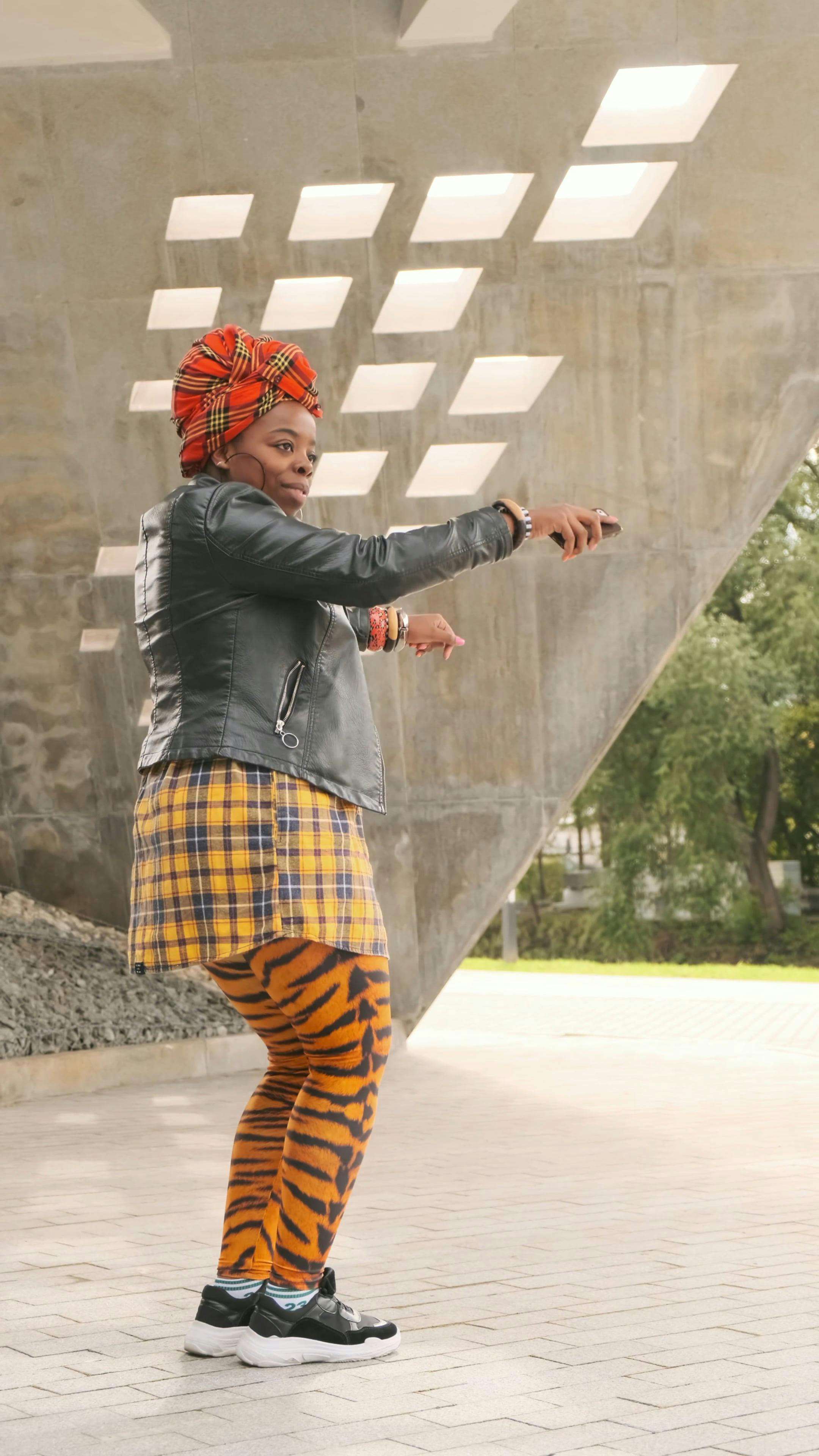 A Woman Dancing Freely Outdoors On A Concrete Pavement Free Stock Video ...