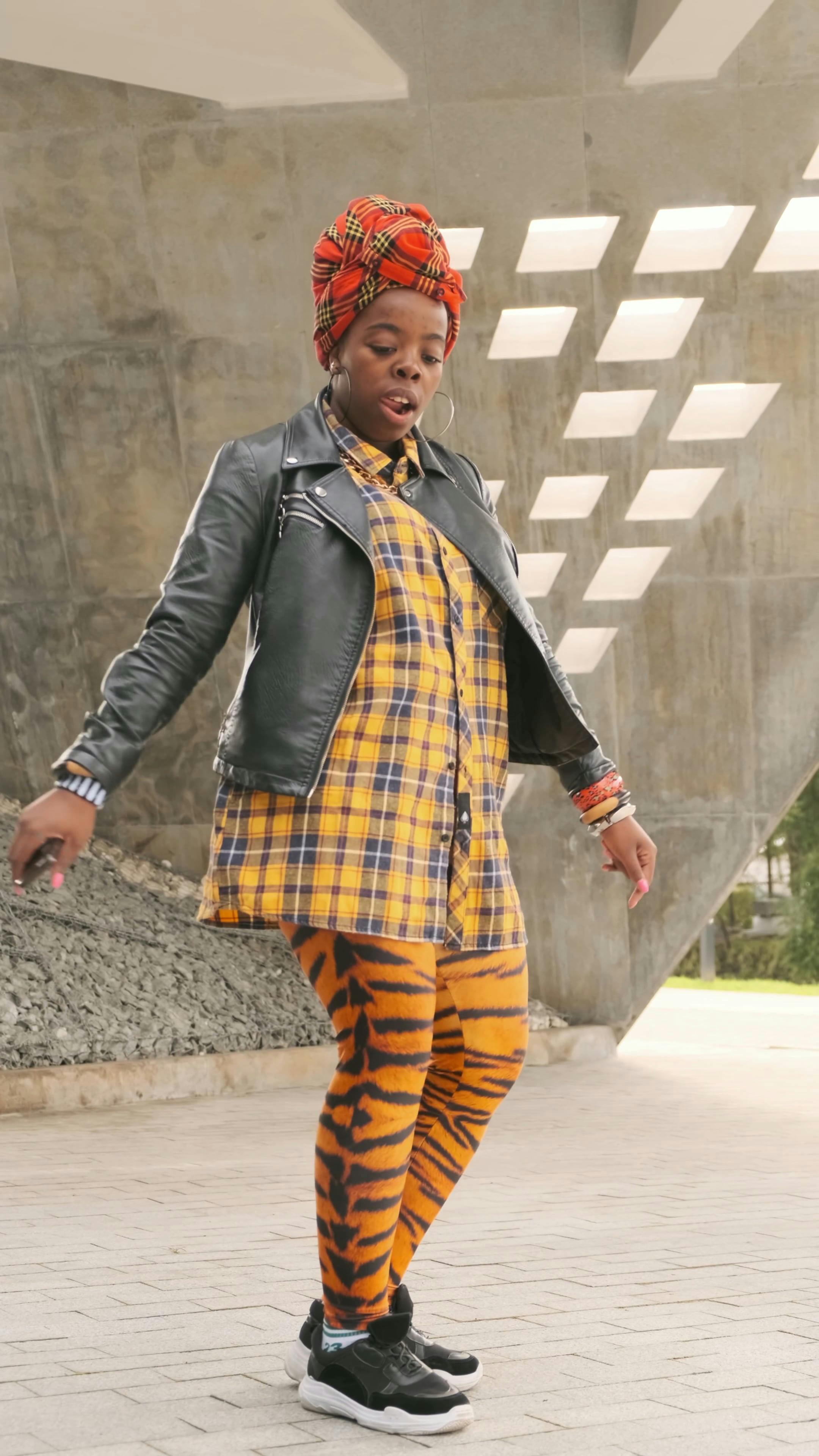 A Woman Dancing Freely Outdoors On A Concrete Pavement Free Stock Video ...