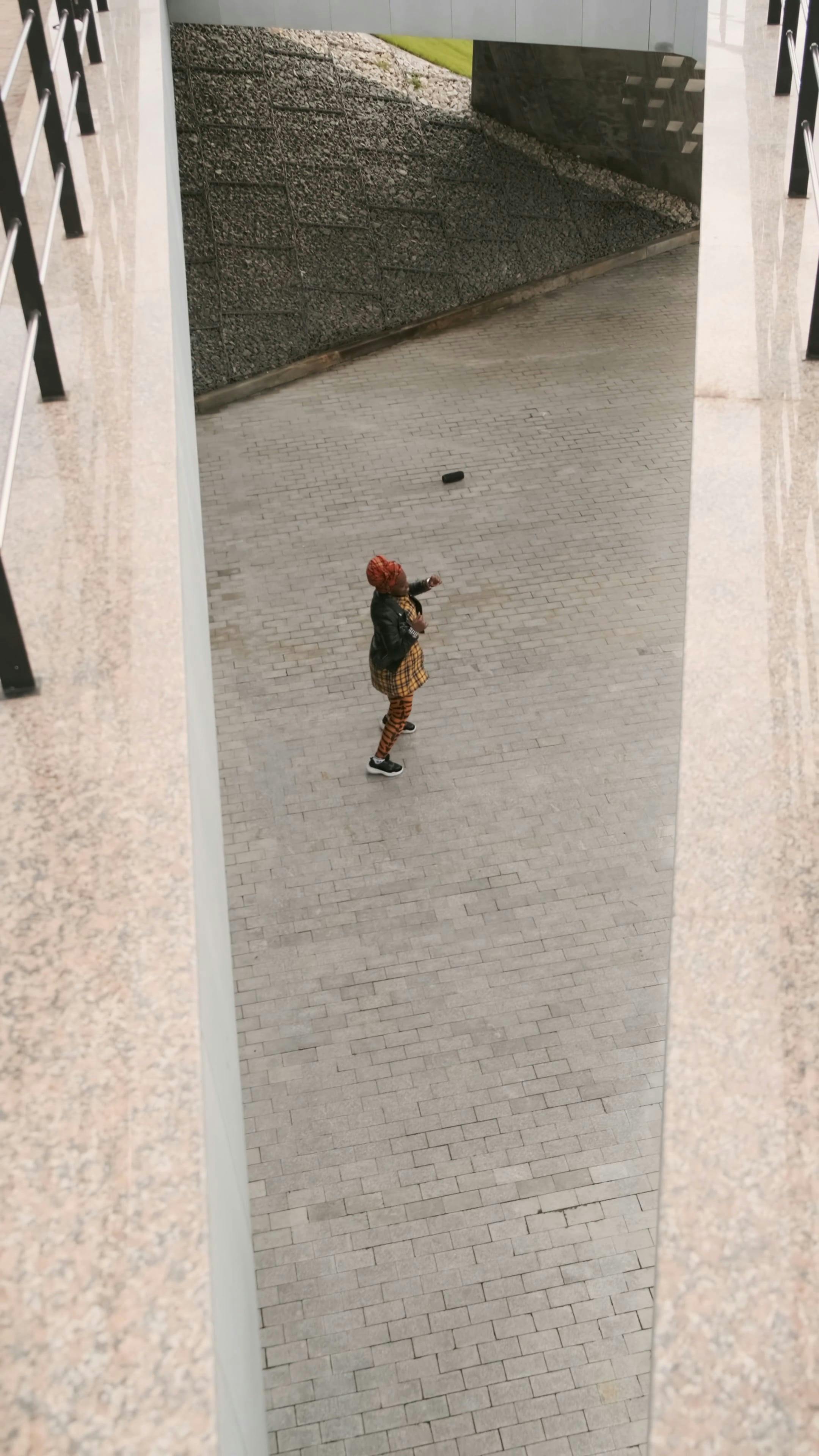 A Woman Dancing Outside Of The Building Hallway Free Stock Video ...