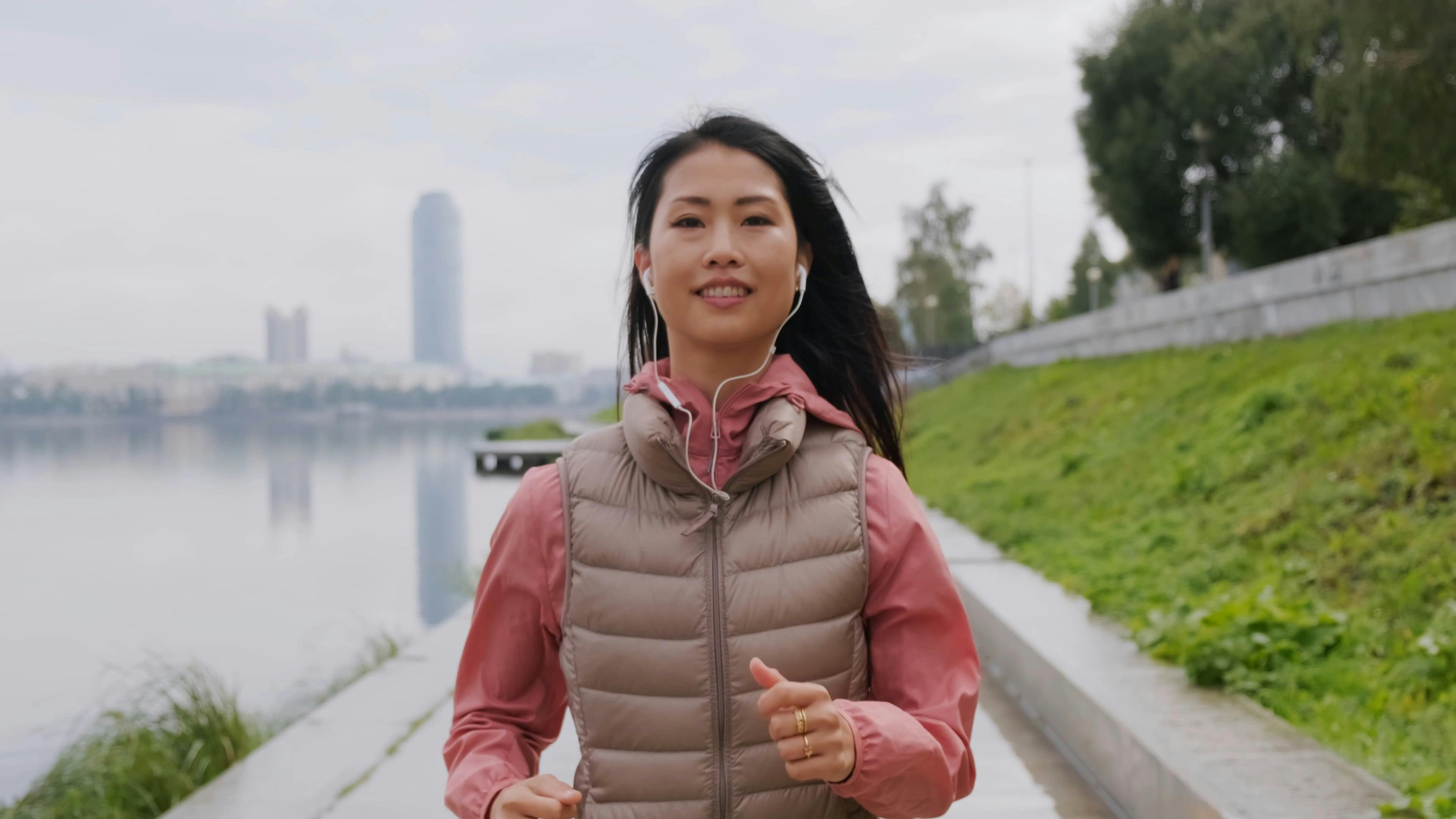 A Woman Wears A Smile While Jogging · Free Stock Video