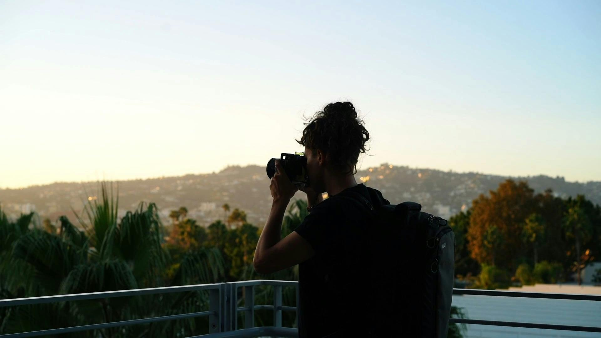 Person Taking Picture Using a Camera · Free Stock Video