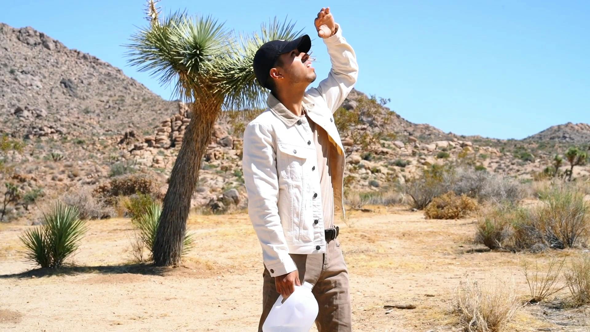 A Man Under The Heat Of The Sun Takes A Drink From A Gallon Of Water ...