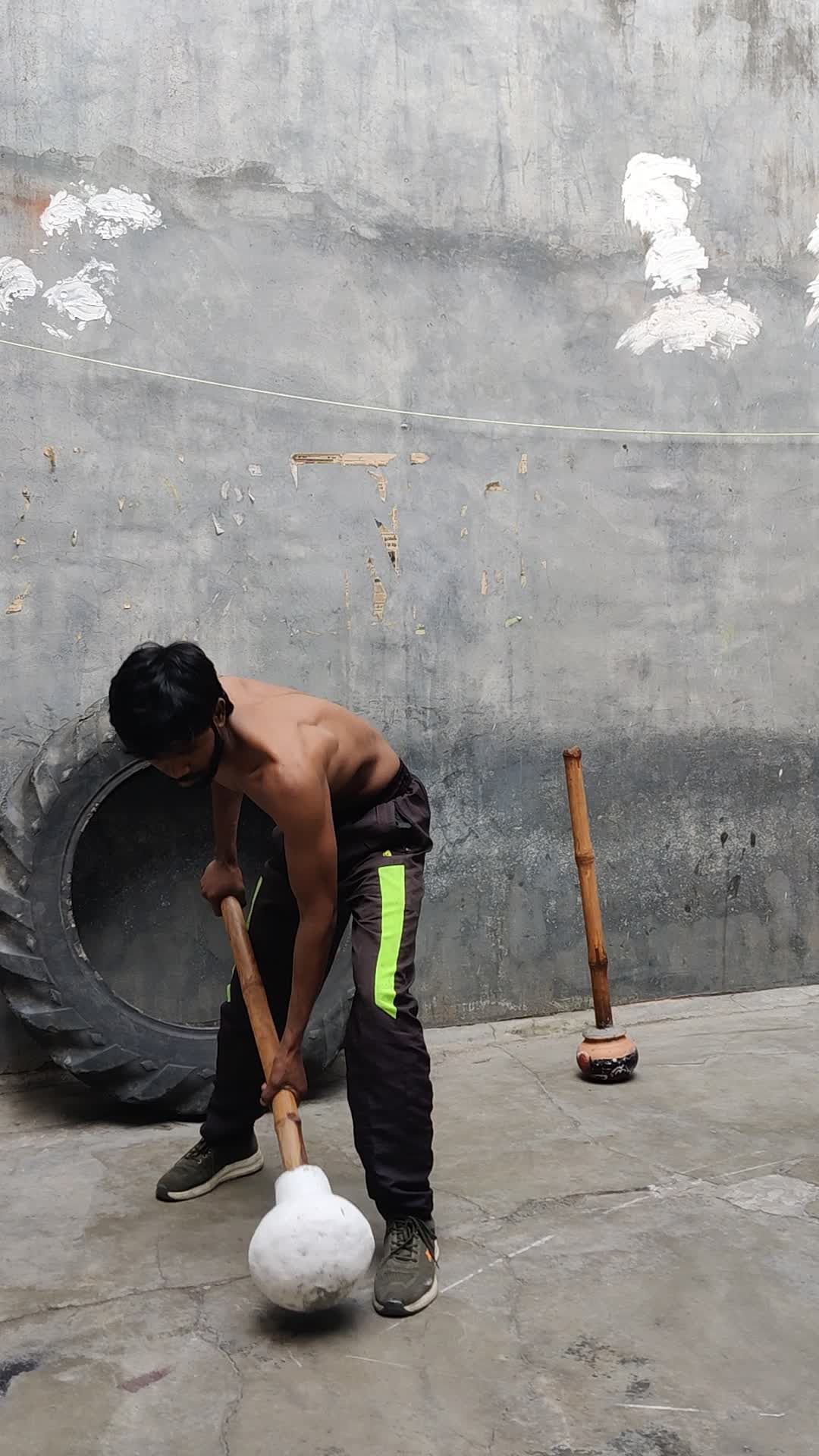 Intense Workout with Gada in Industrial Setting Free Stock Video ...