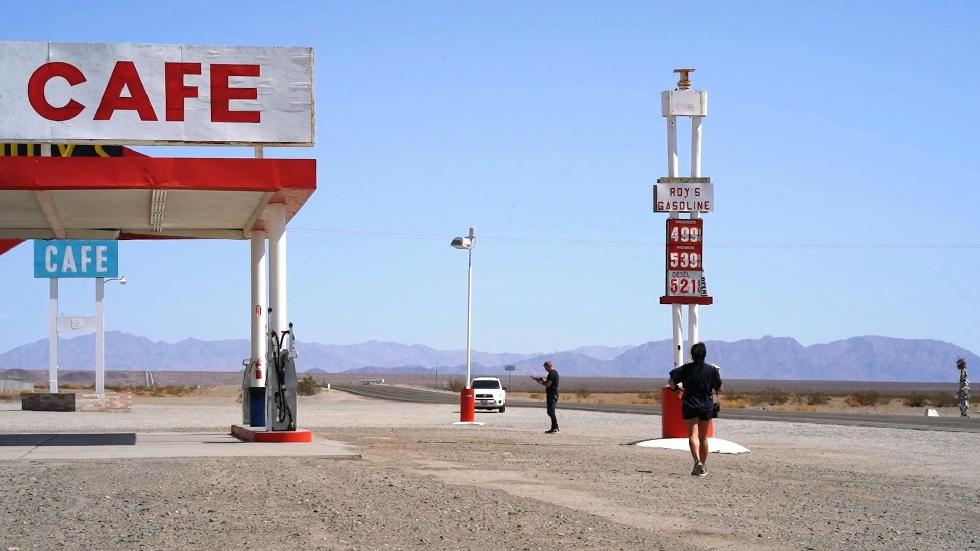People And Vehicular Traffic Of A Rest Stop Area Along The Desert Hi ...