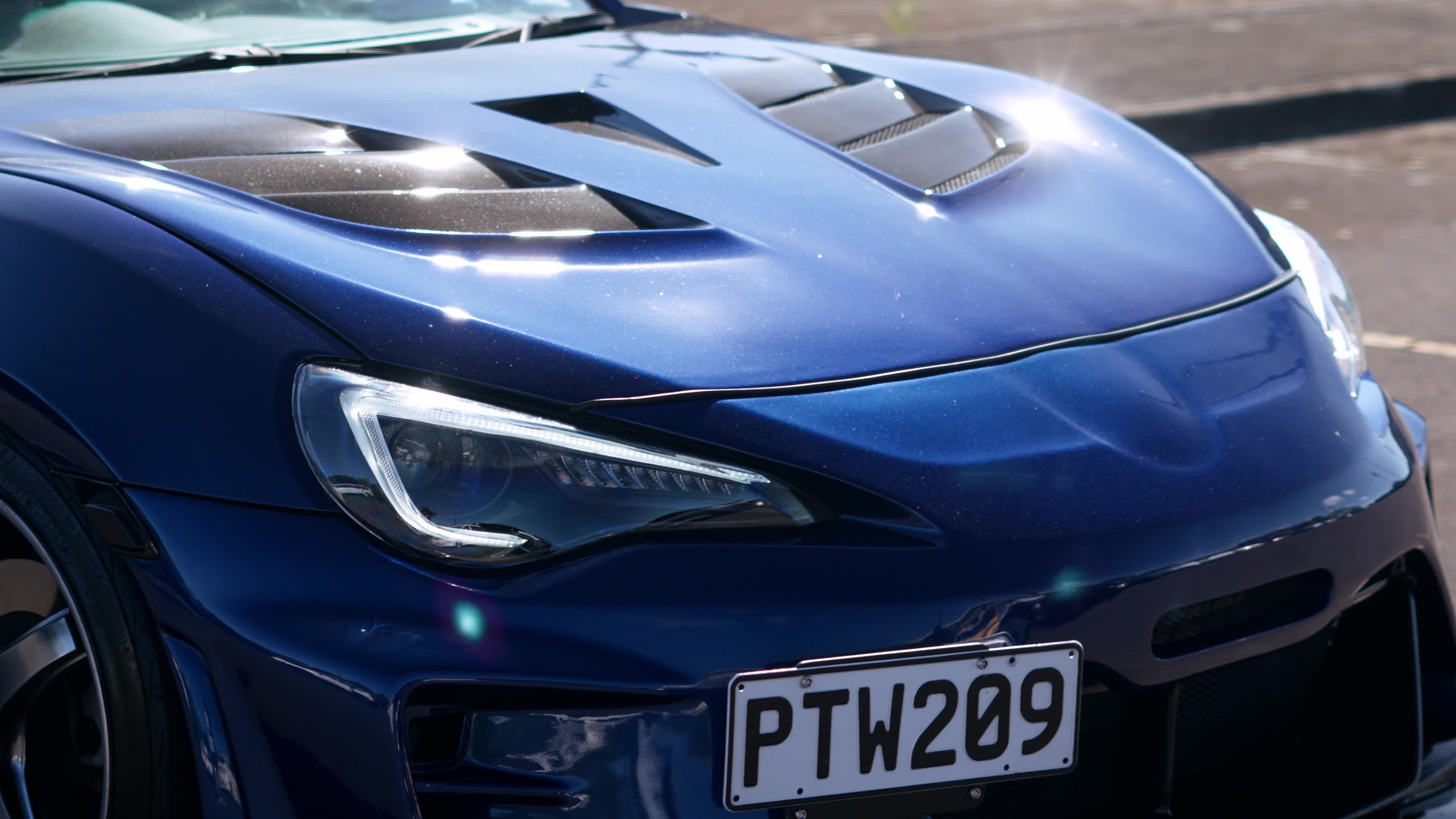 Sleek Blue Sports Car with Customized Bodywork Free Stock Video Footage ...