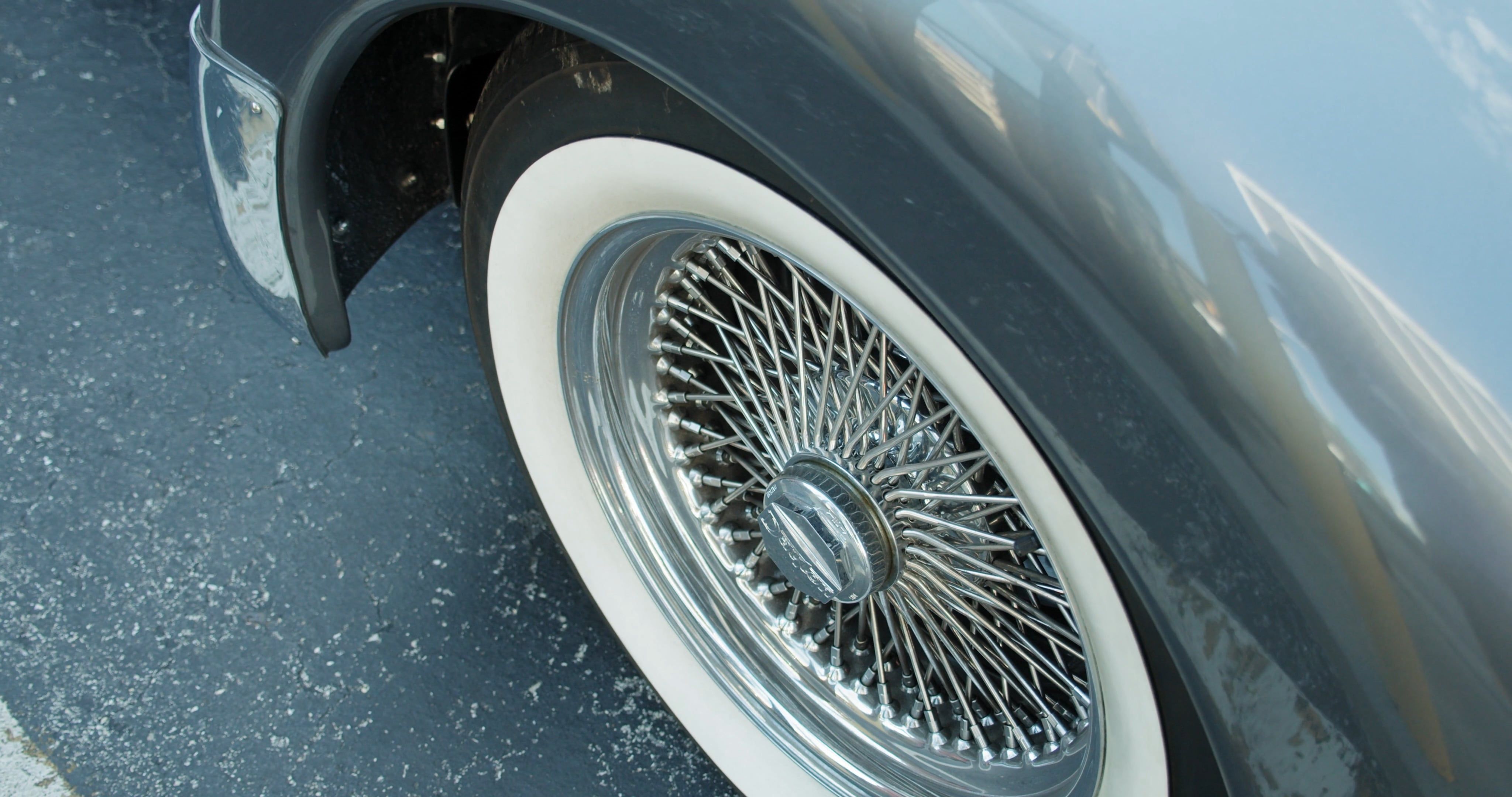 Close-up Footage Of A Classic White-Side Wall Tire On Spoke Rims · Free ...