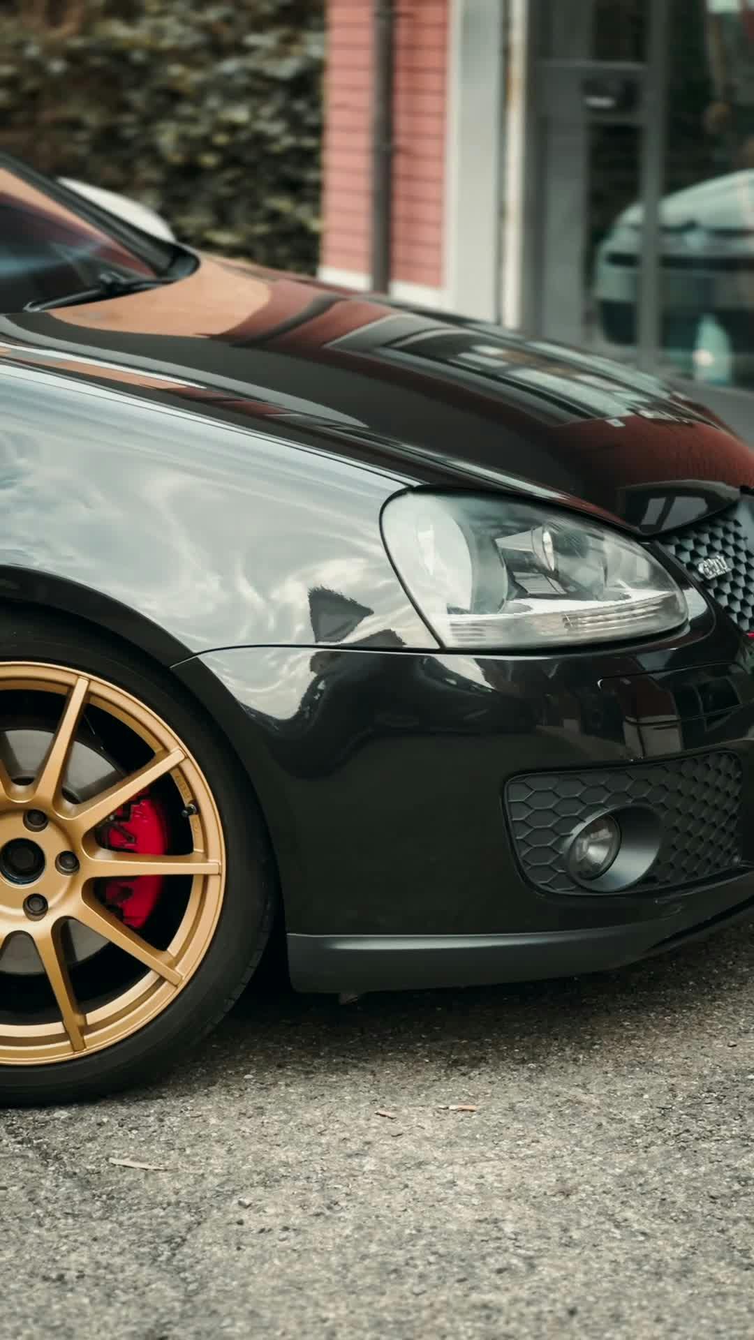 Sleek Black Car with Custom Gold Rims in Urban Setting Free Stock Video ...