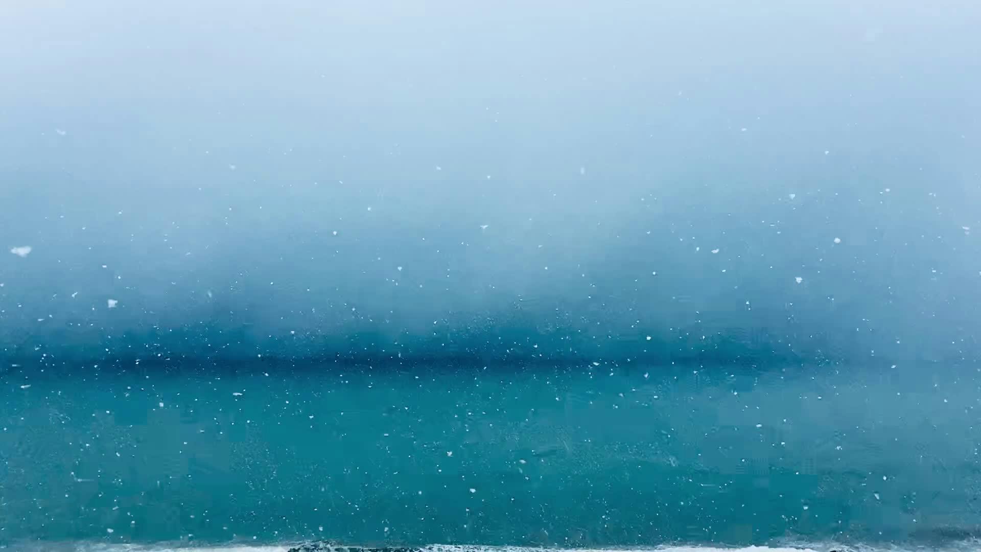 Serene Snowfall Over a Tranquil Ocean Landscape Free Stock Video ...