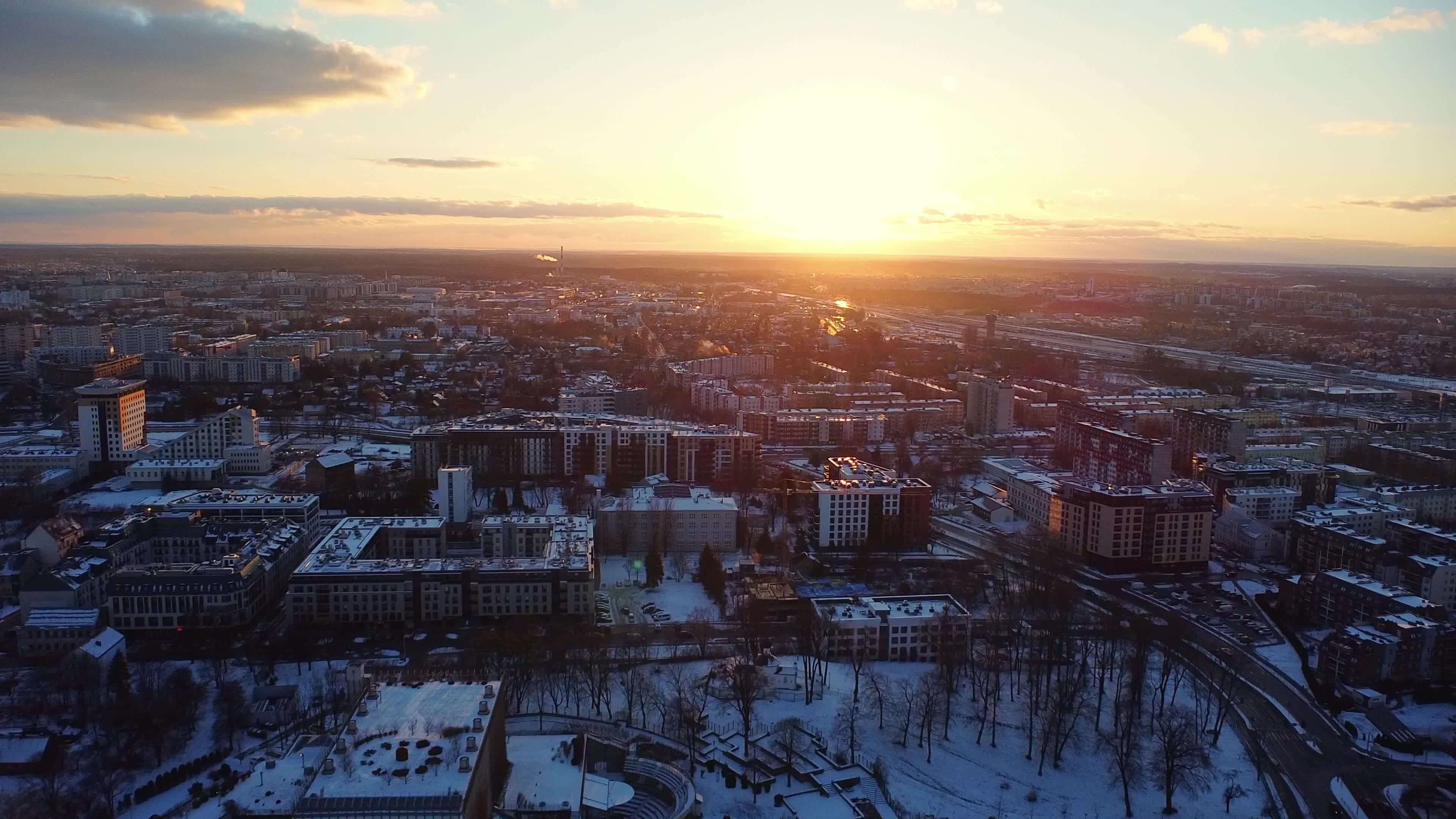 Aerial Cityscape at Sunset Over Snowy Urban Area Free Stock Video ...