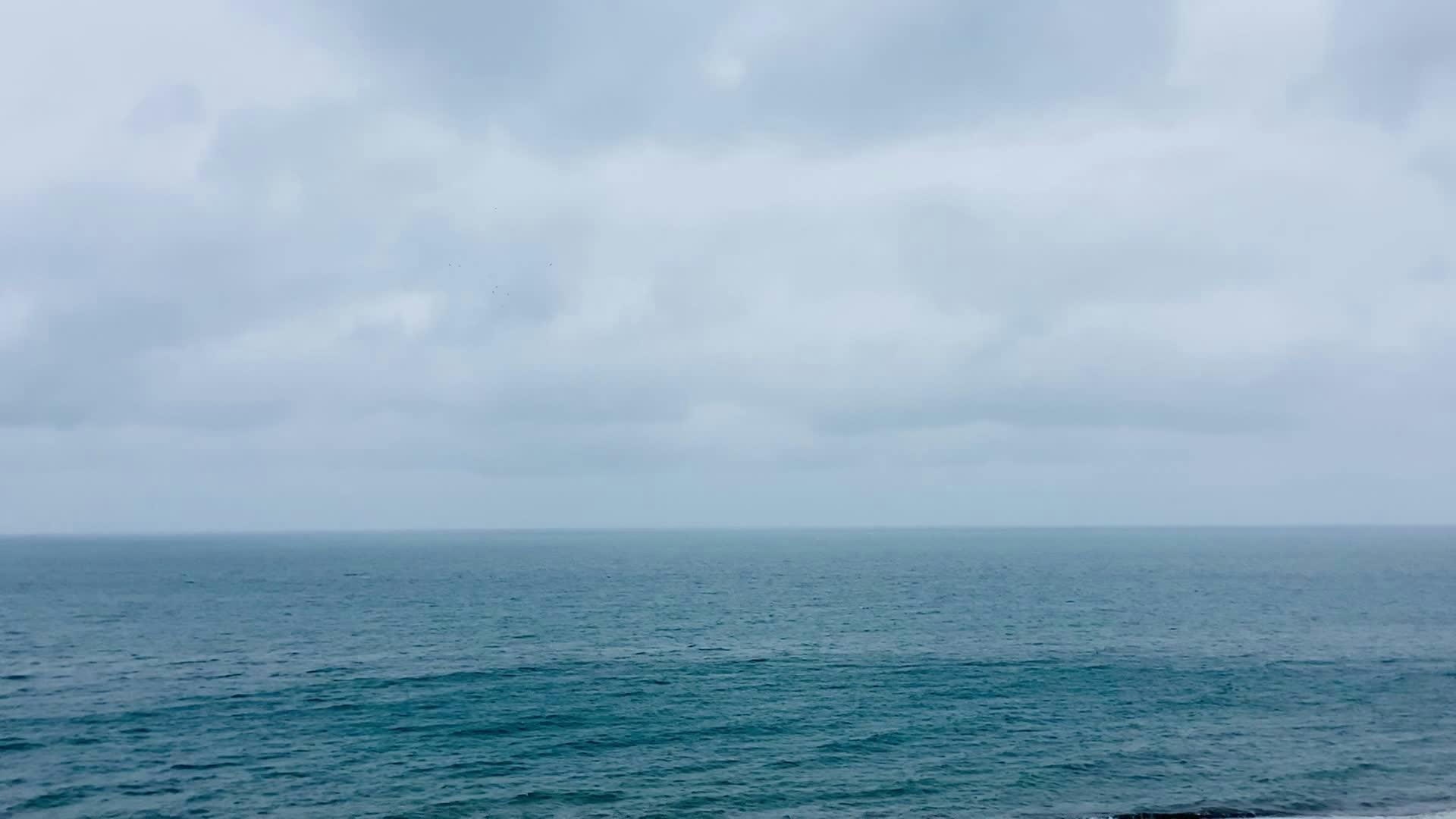 Tranquil Overcast Ocean View with Calm Waves Free Stock Video Footage ...