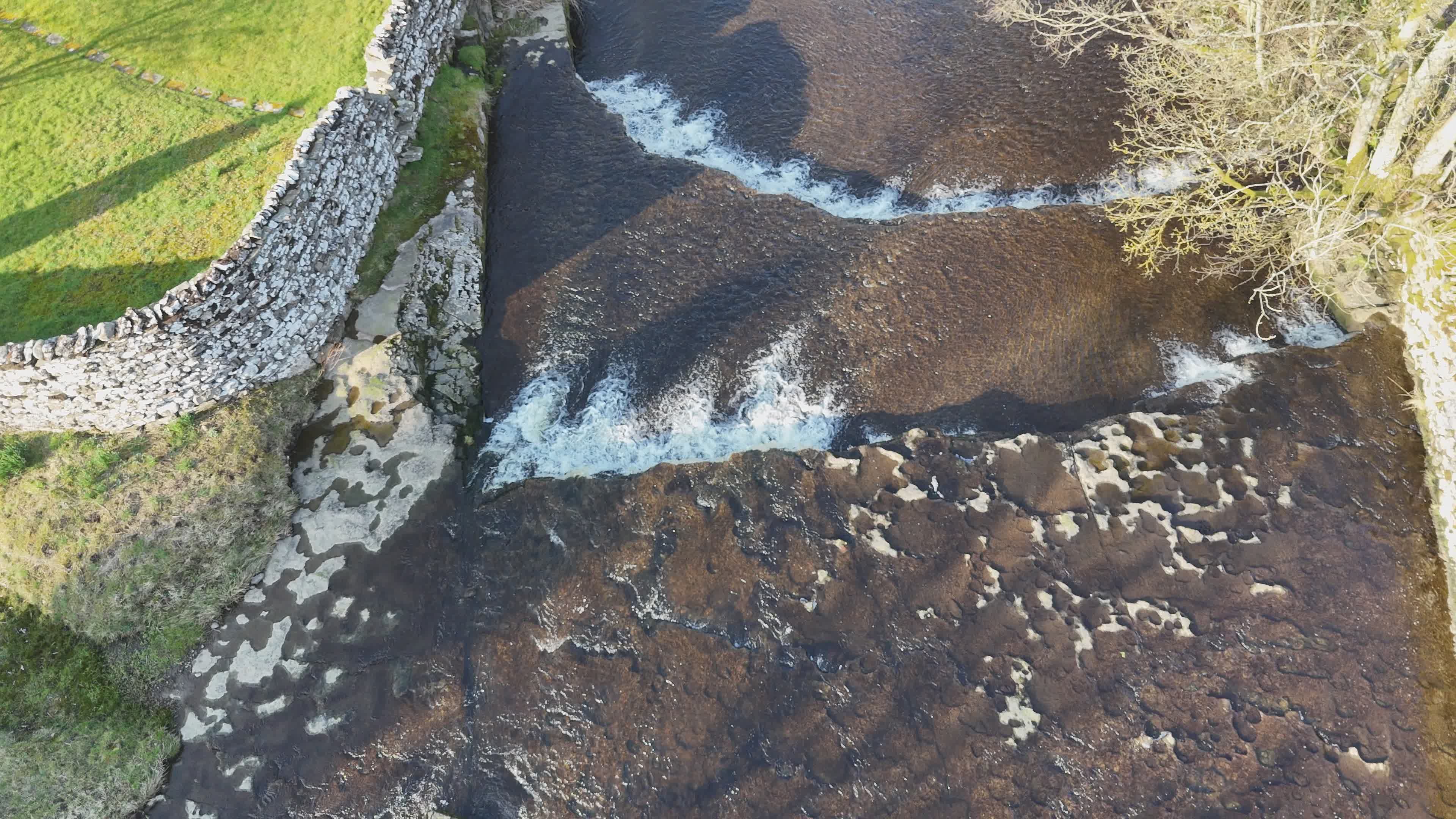 Aerial view of tranquil river and stone wall Free Stock Video Footage ...