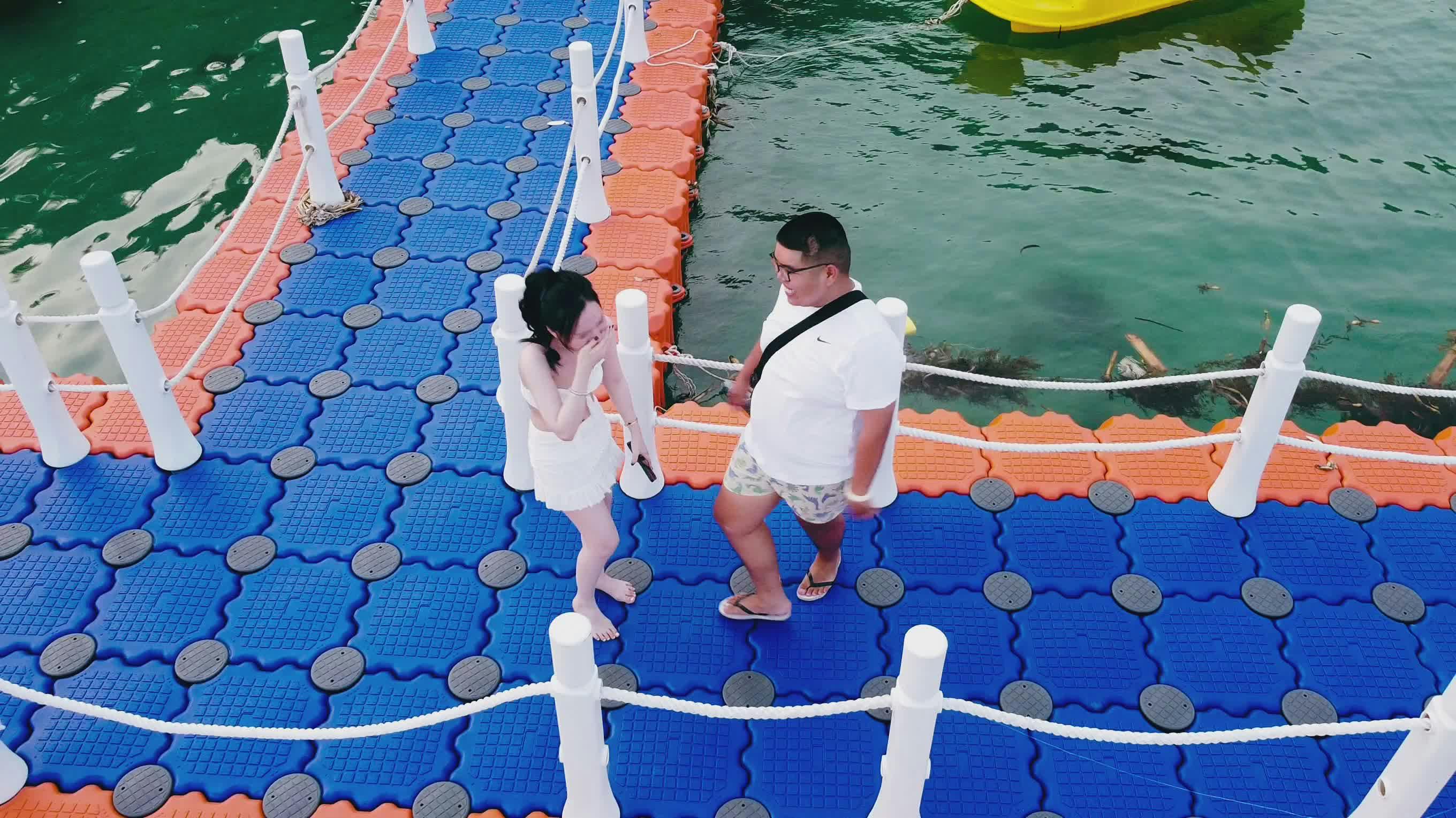 Couple Strolling on a Vibrant Floating Dock Free Stock Video Footage ...