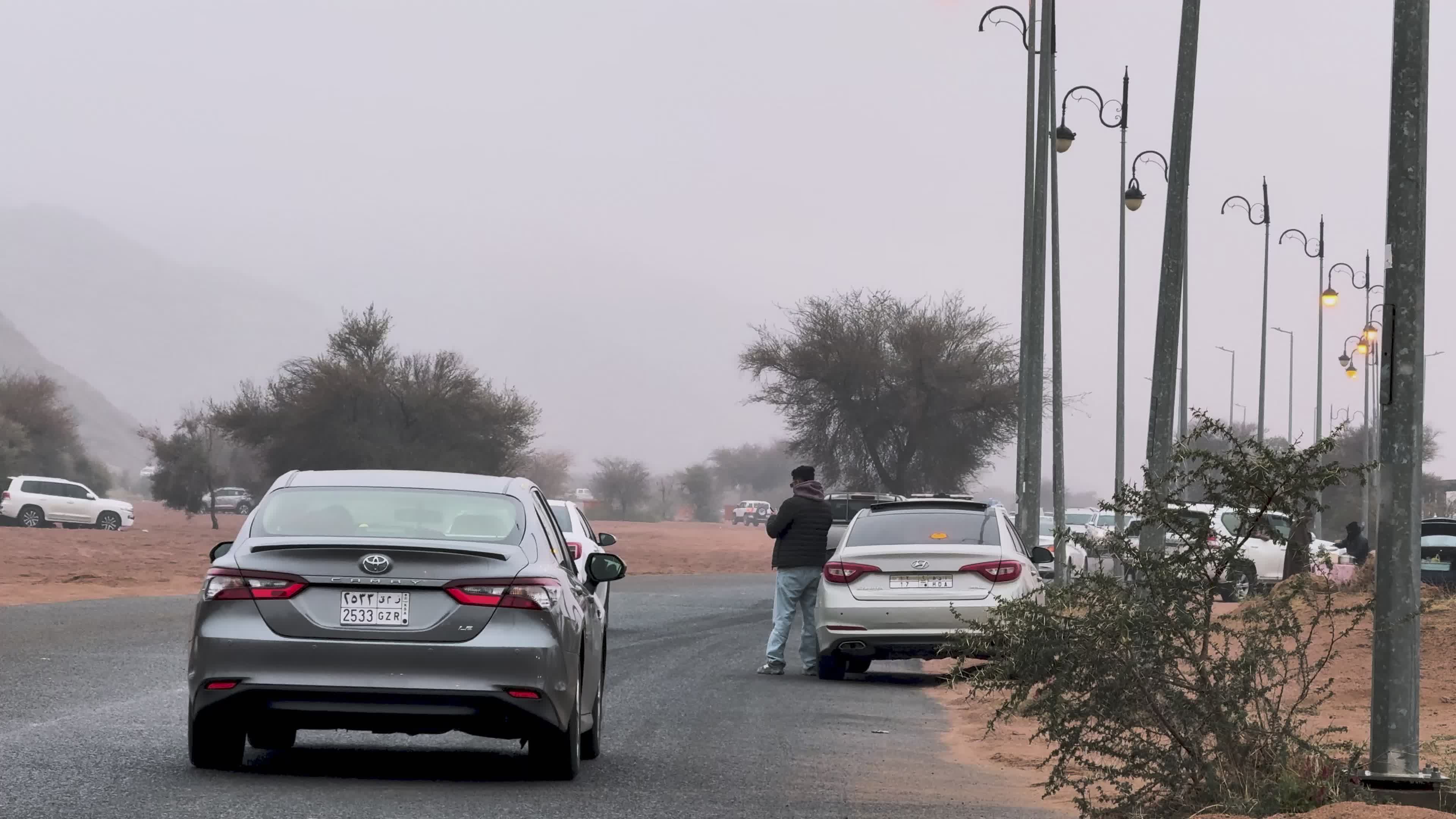 Desert Road Scene with Multiple Parked Cars Free Stock Video Footage ...