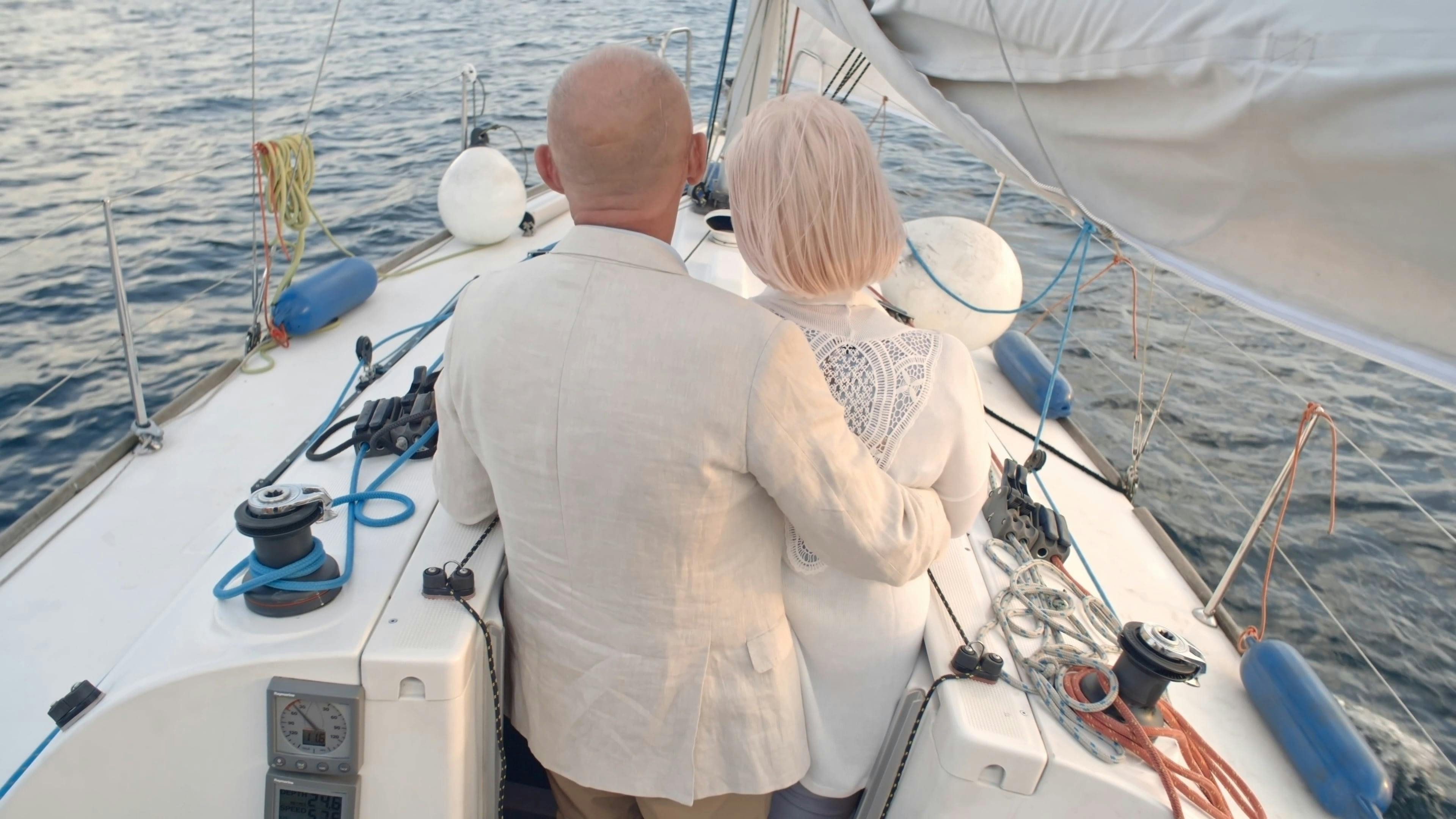 Backside Of A Couple In A Loving Embrace On A Seaborne Sailboat Free ...
